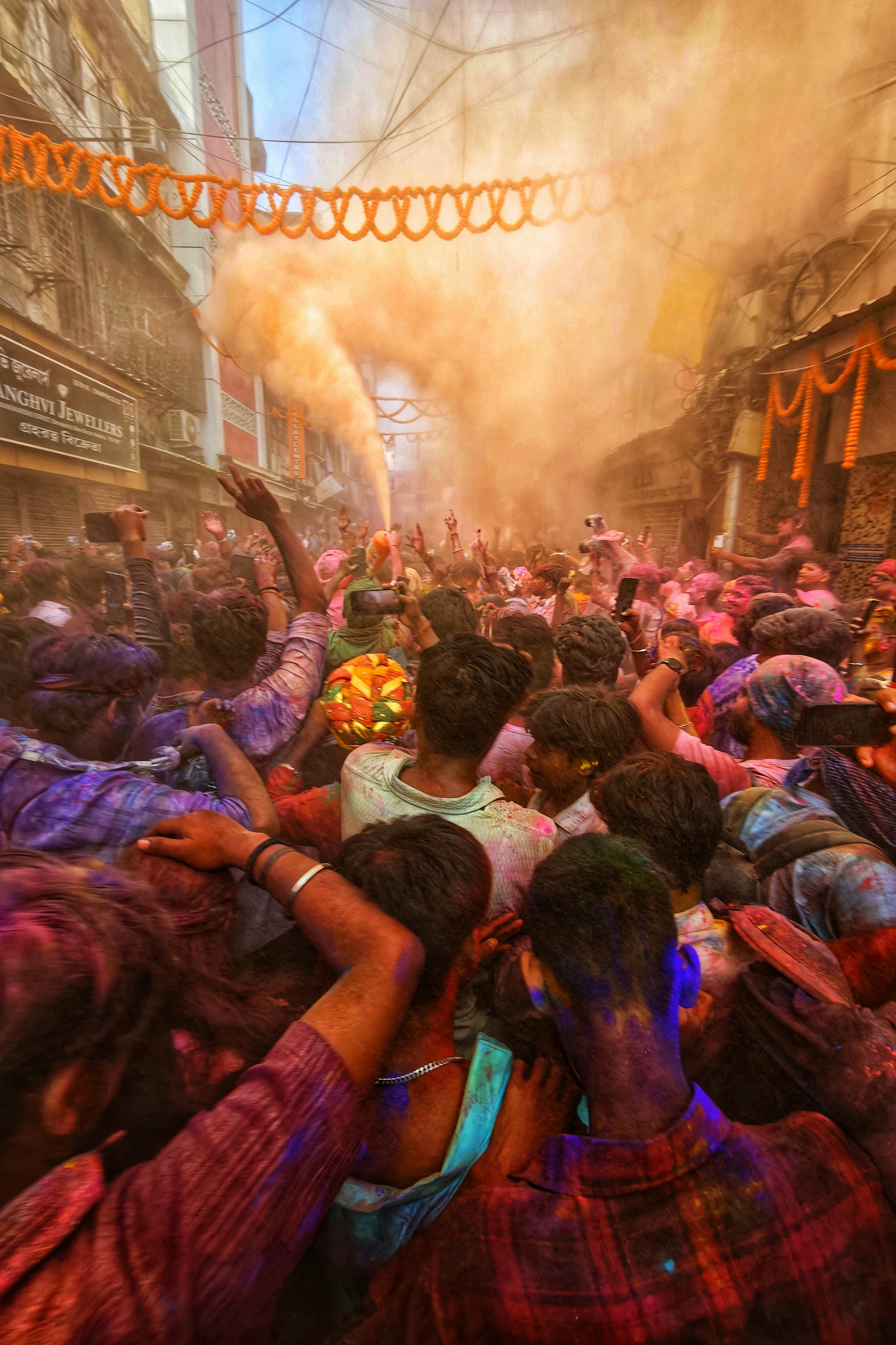 People celebrating holi festival with colored powder