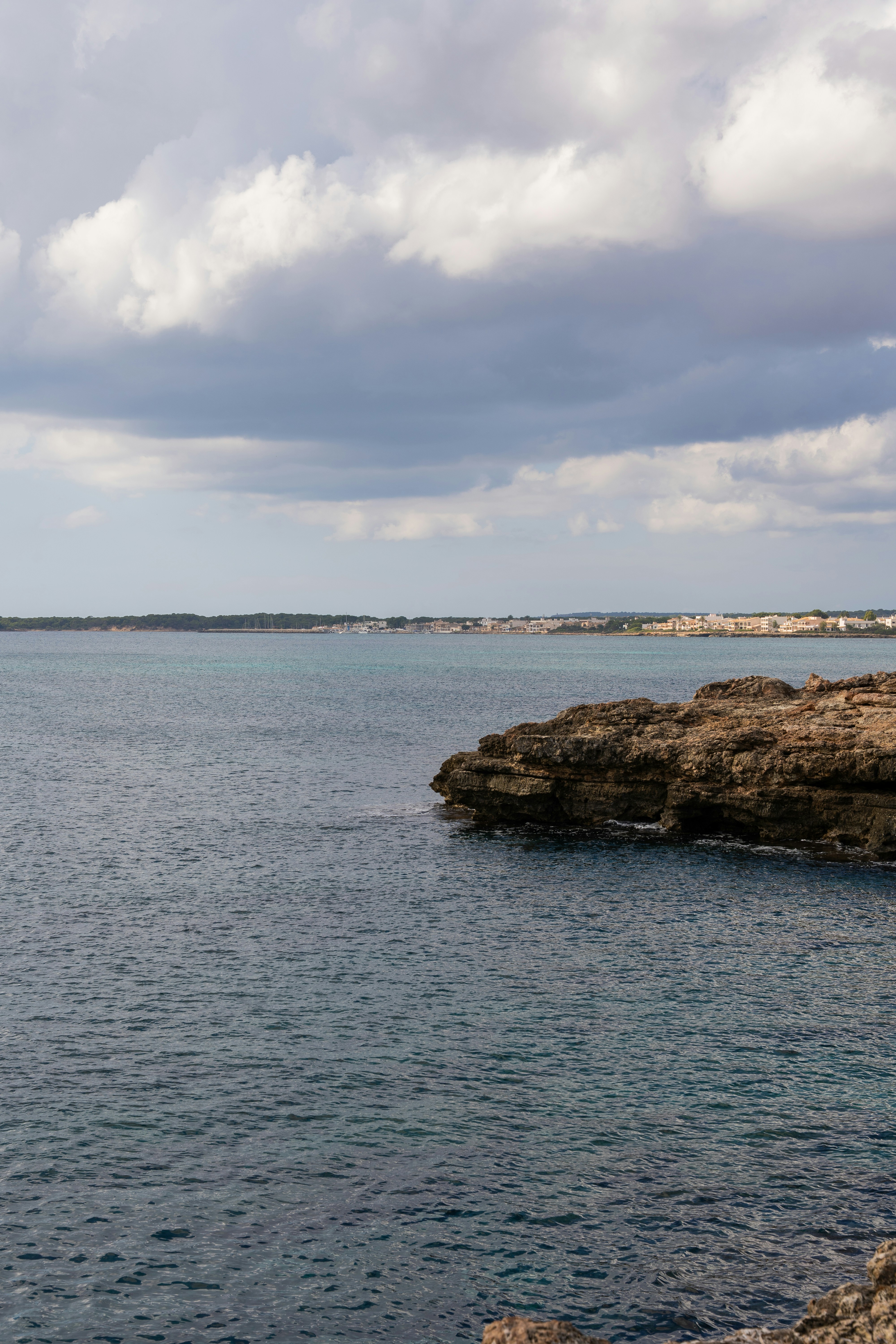 Coastal Cliffs and Quiet Horizon Under Soft Clouds
