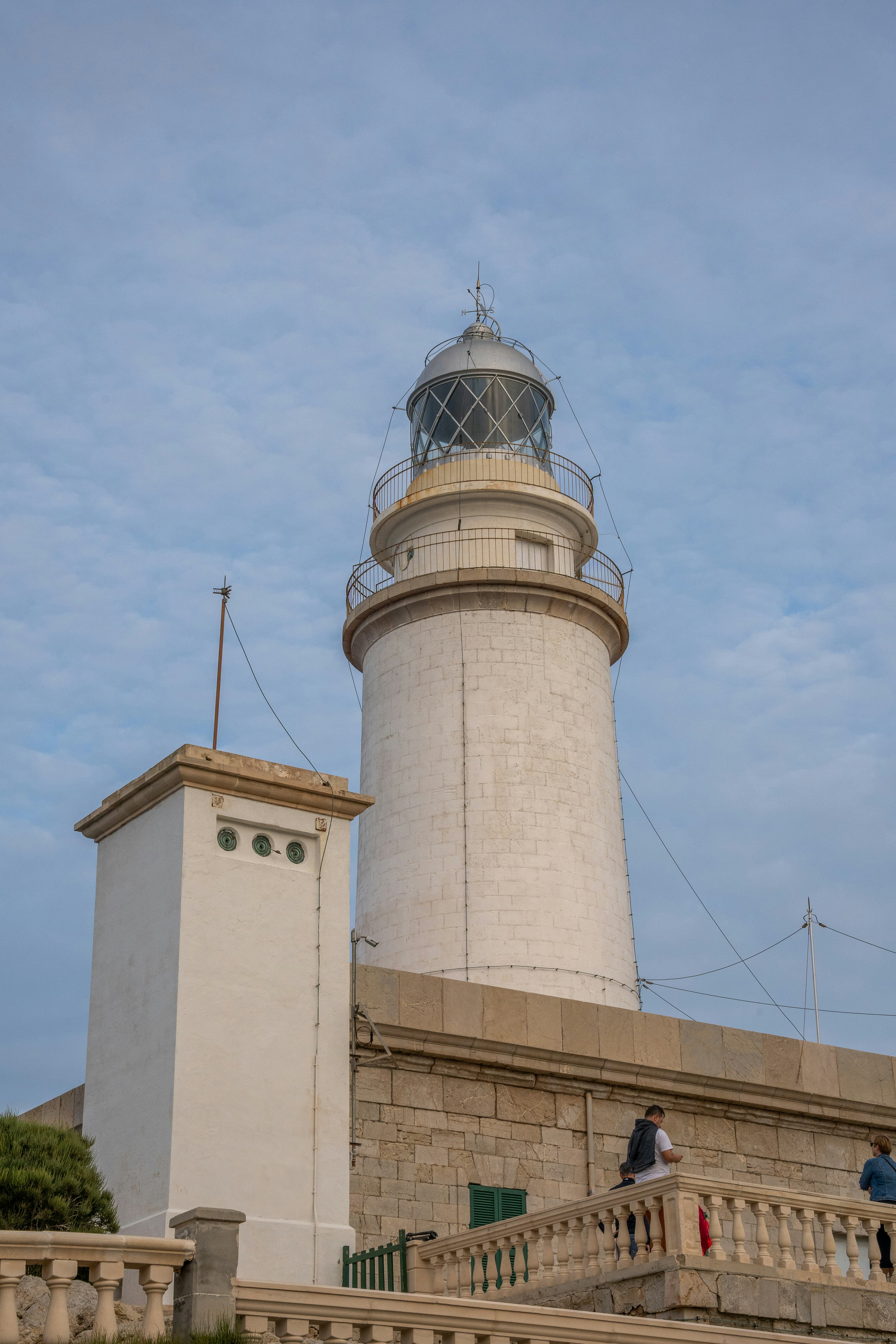  beacon at sea: a sunlit lighthouse and its stone terrace