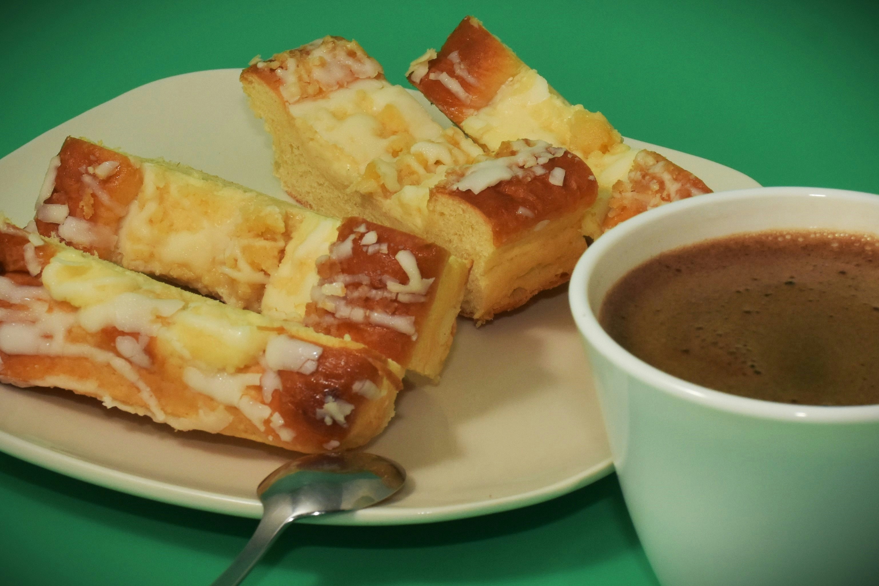 A plate of pastries with a cup of coffee photo – Free Food Image on ...