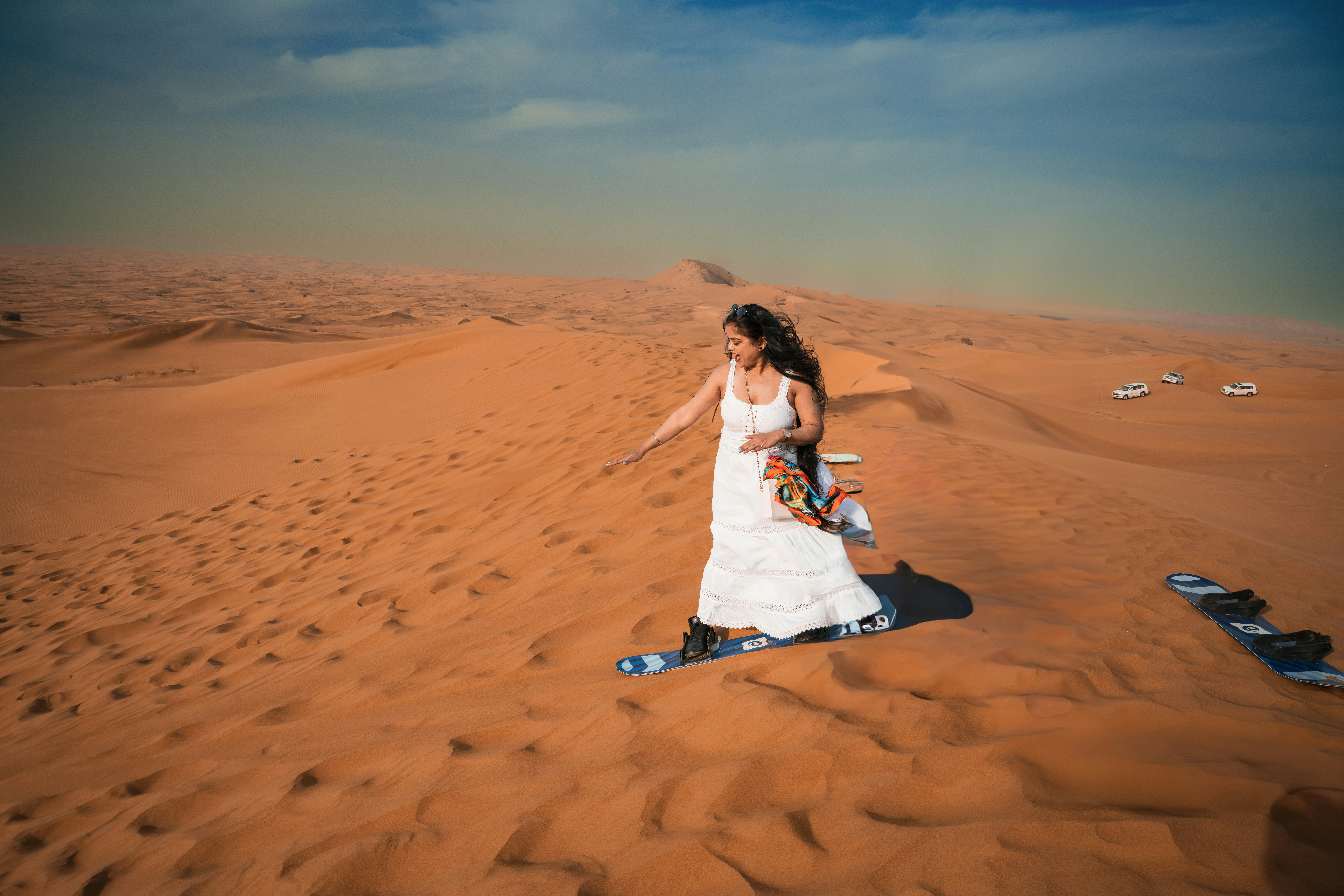 Desert Bride in White: A Solitary Dance Across Dune Ridges