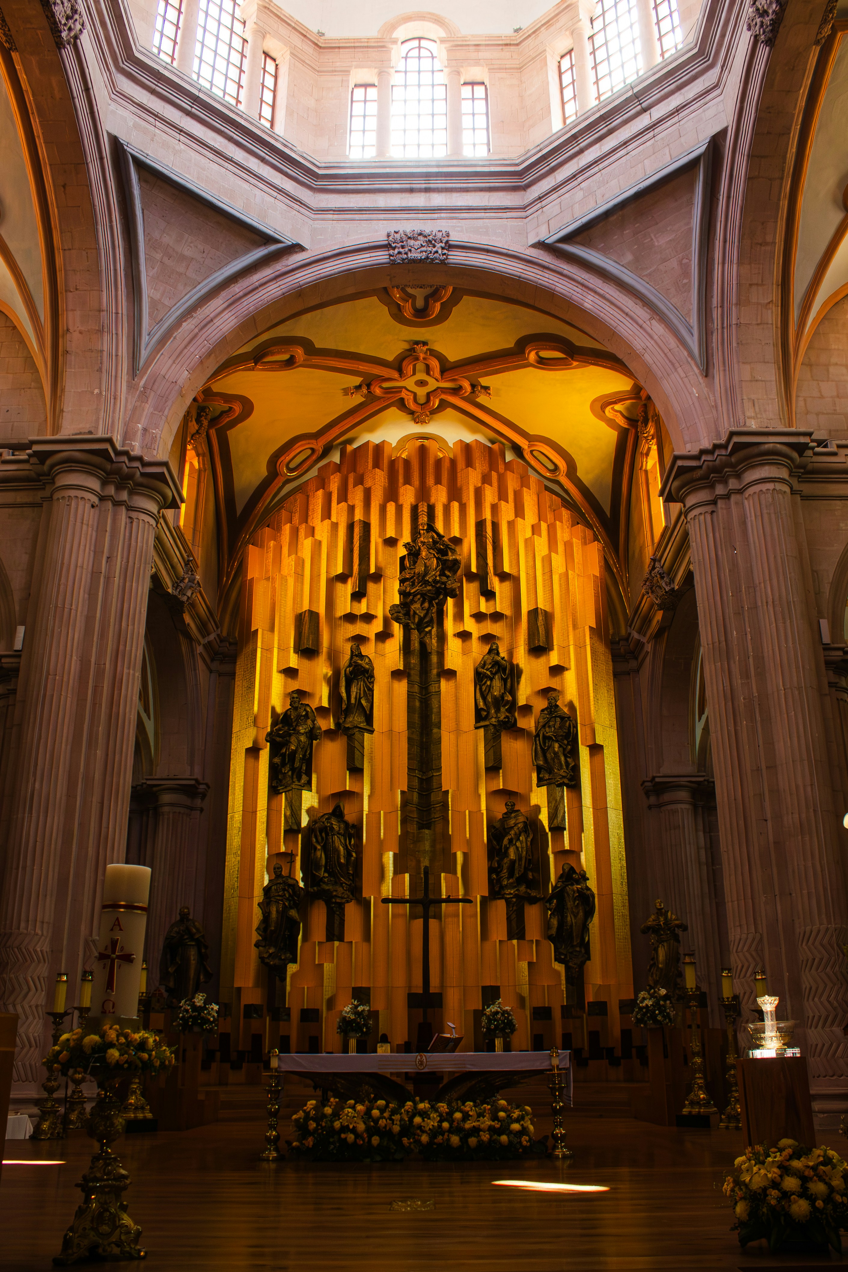 Golden organ arches: cathedral interior illuminated by warm hues