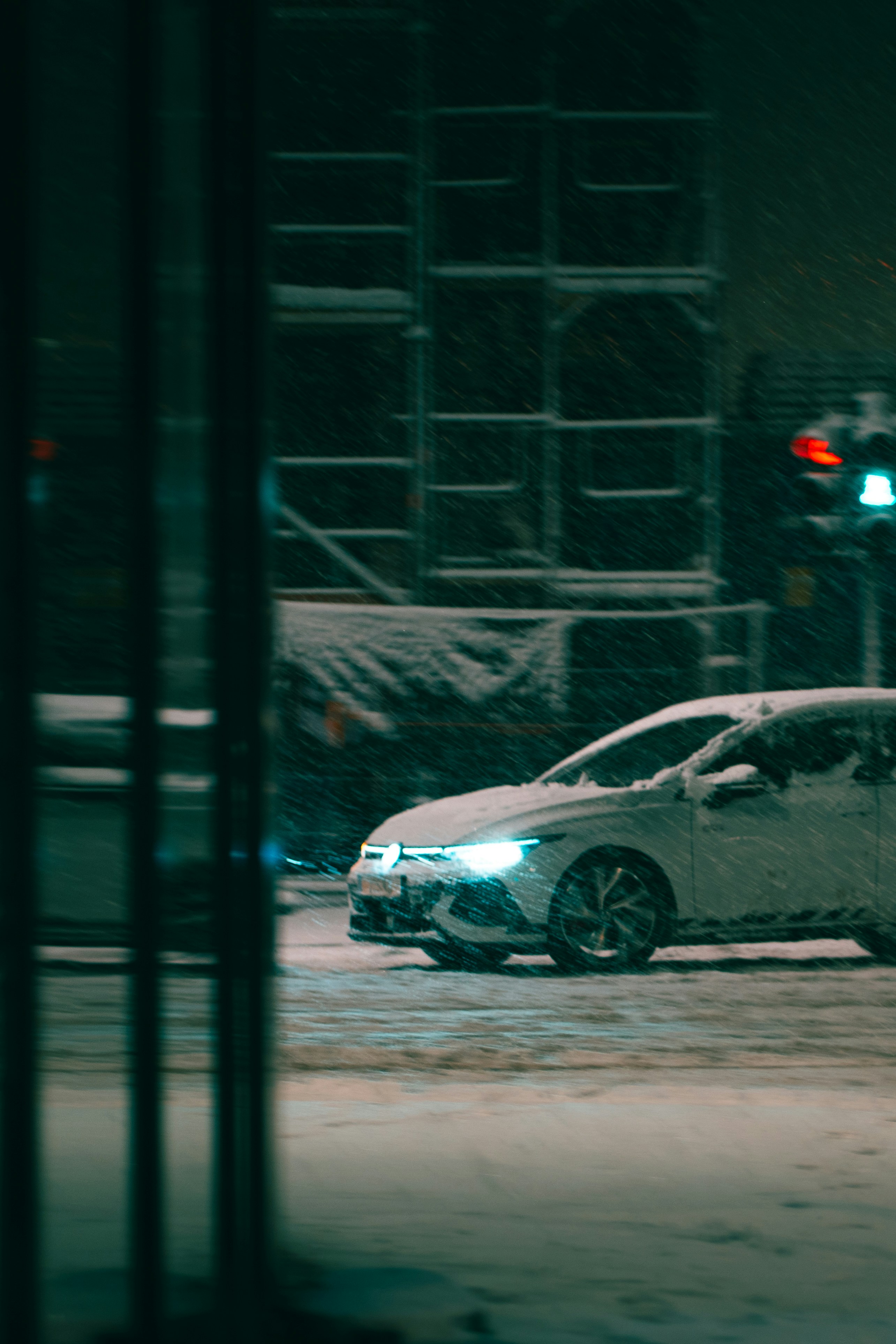 Snowbound Streetcar: A Solitary Vehicle in Midnight Snowfall
