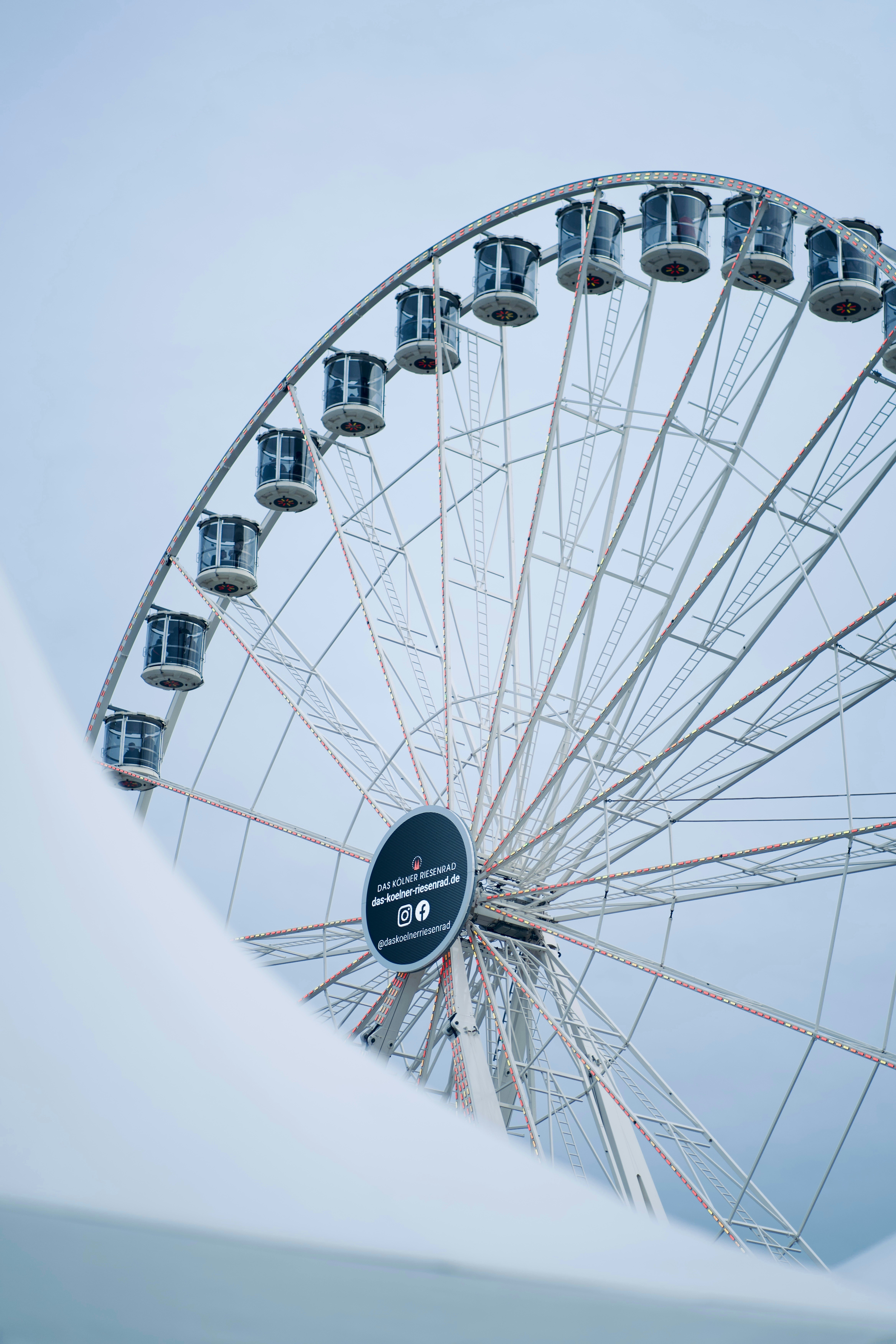 Ferris Wheel Framed Through a Curved Window