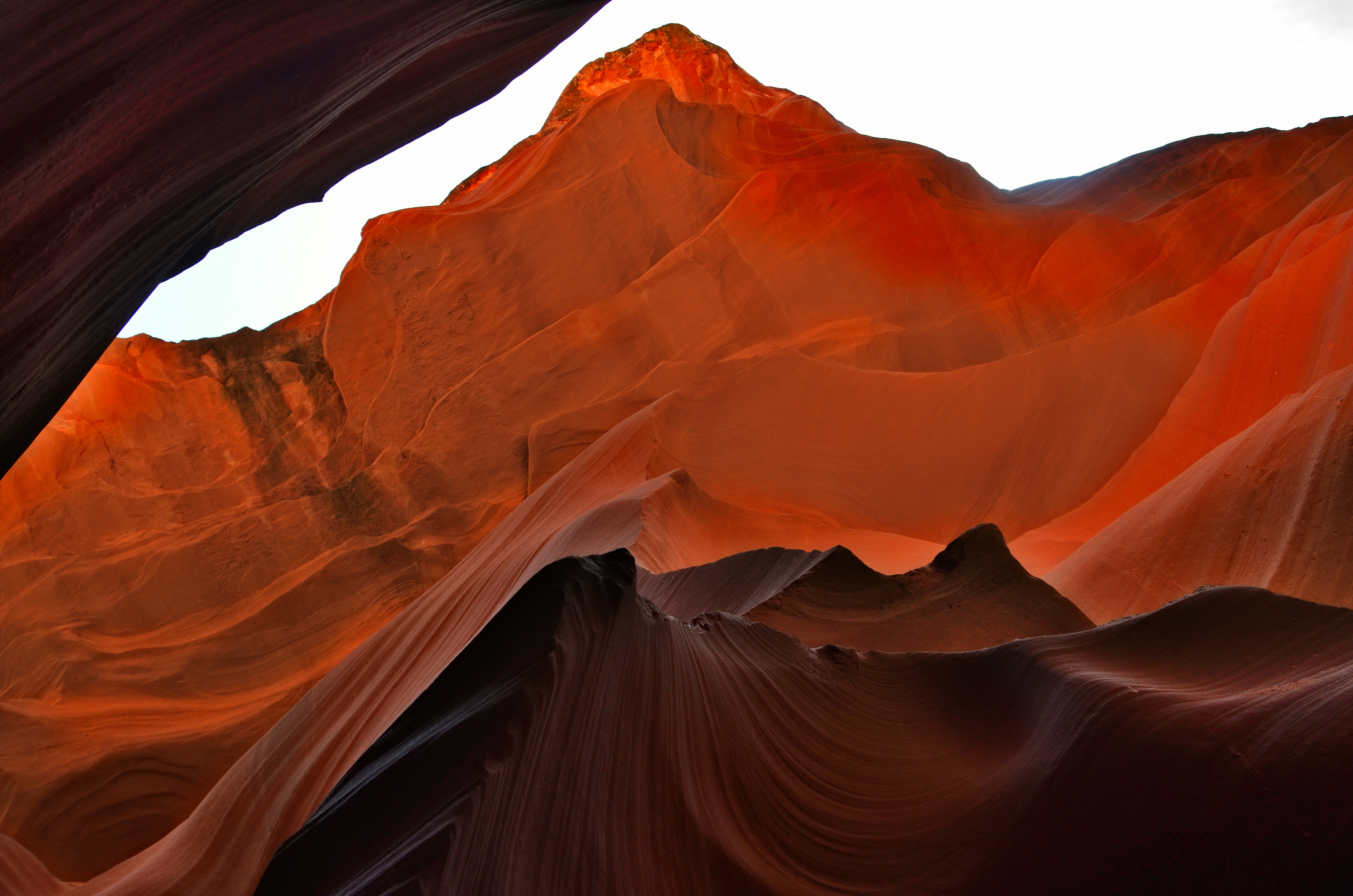 Fiery Marble Peaks: Light Embraces the Wind-Carved Canyon