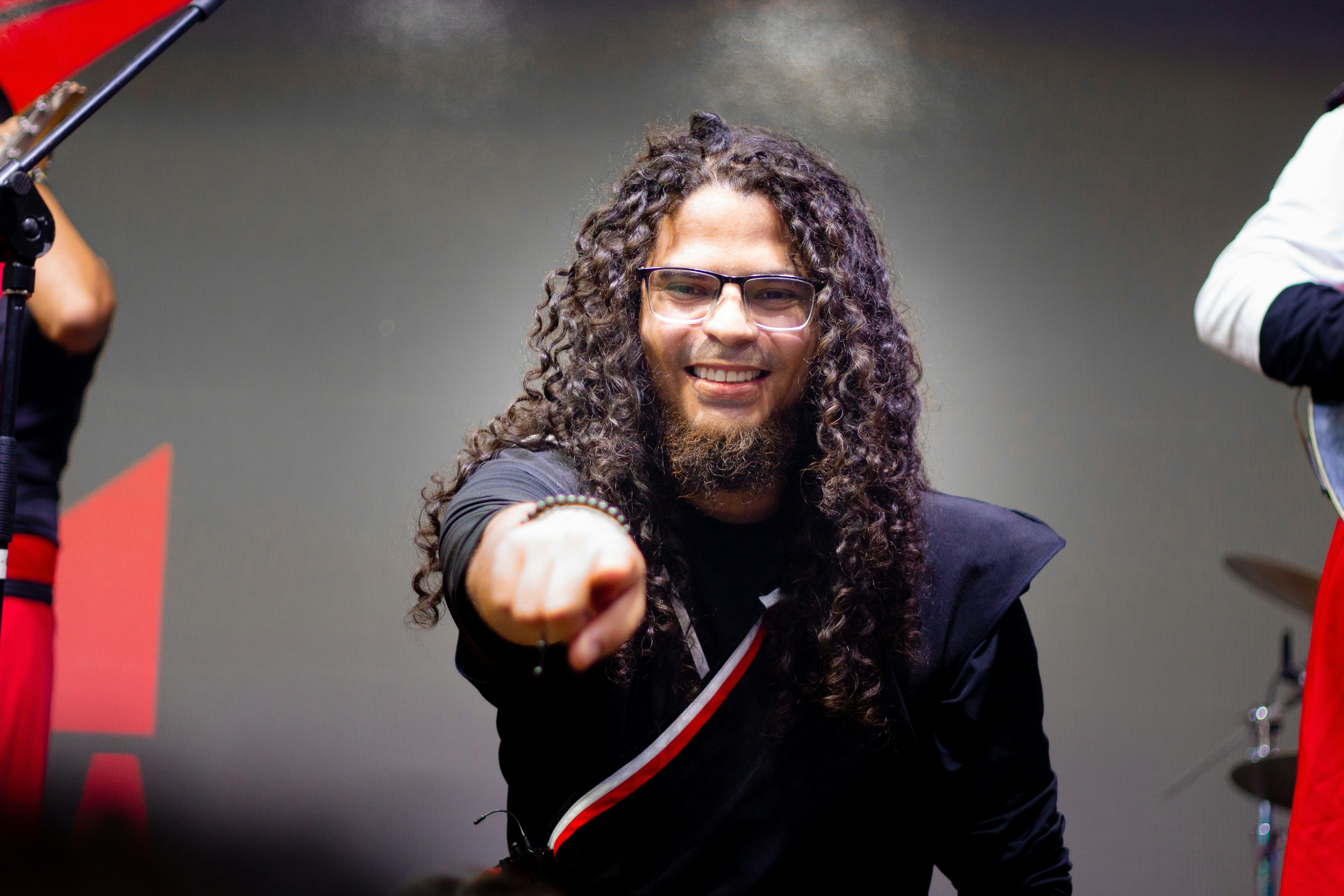 Energetic Frontman Breaks into the Crowd with a Flourishing Fist