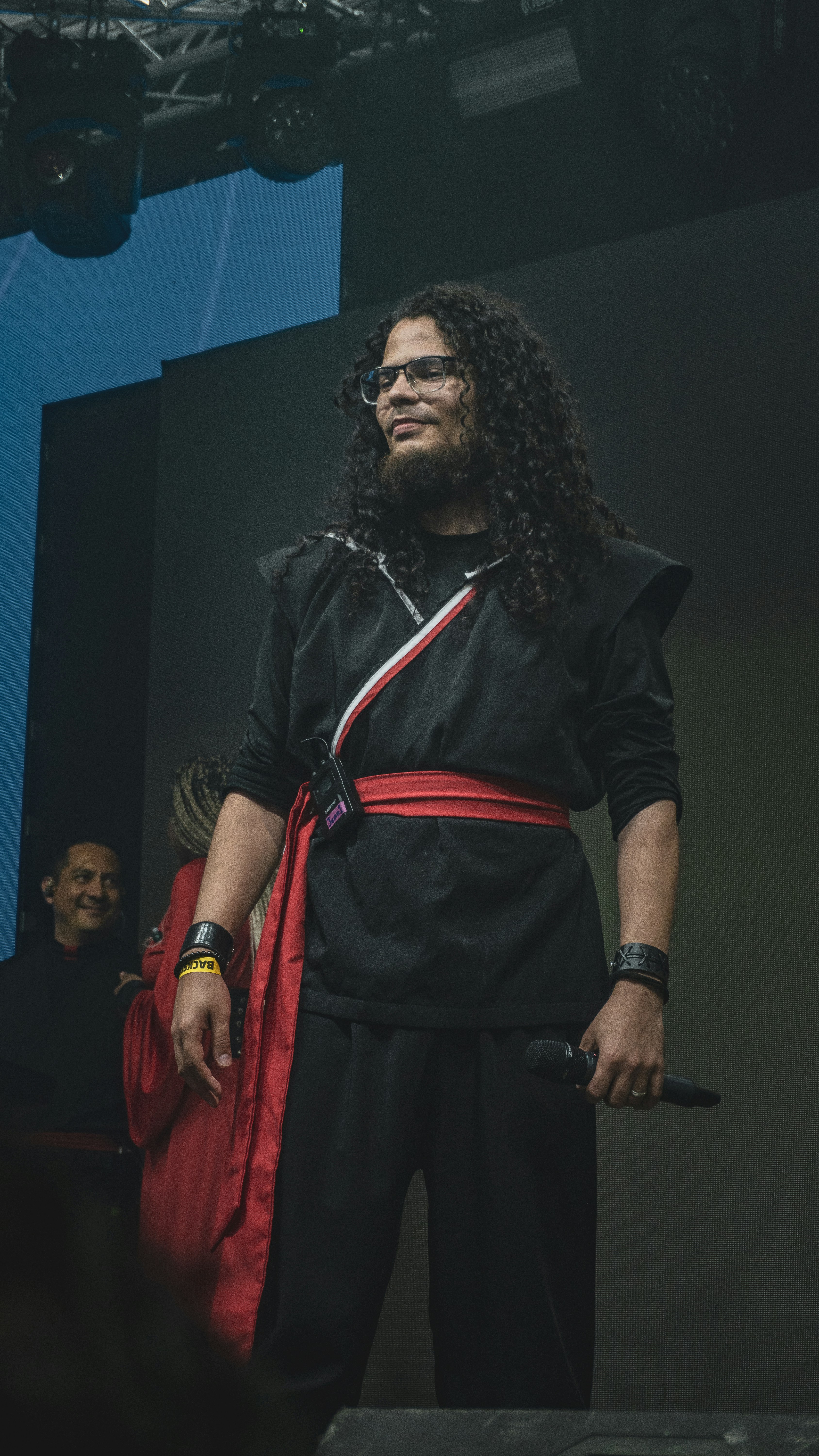 Stage Persona: Ethereal Performer in Black and Red