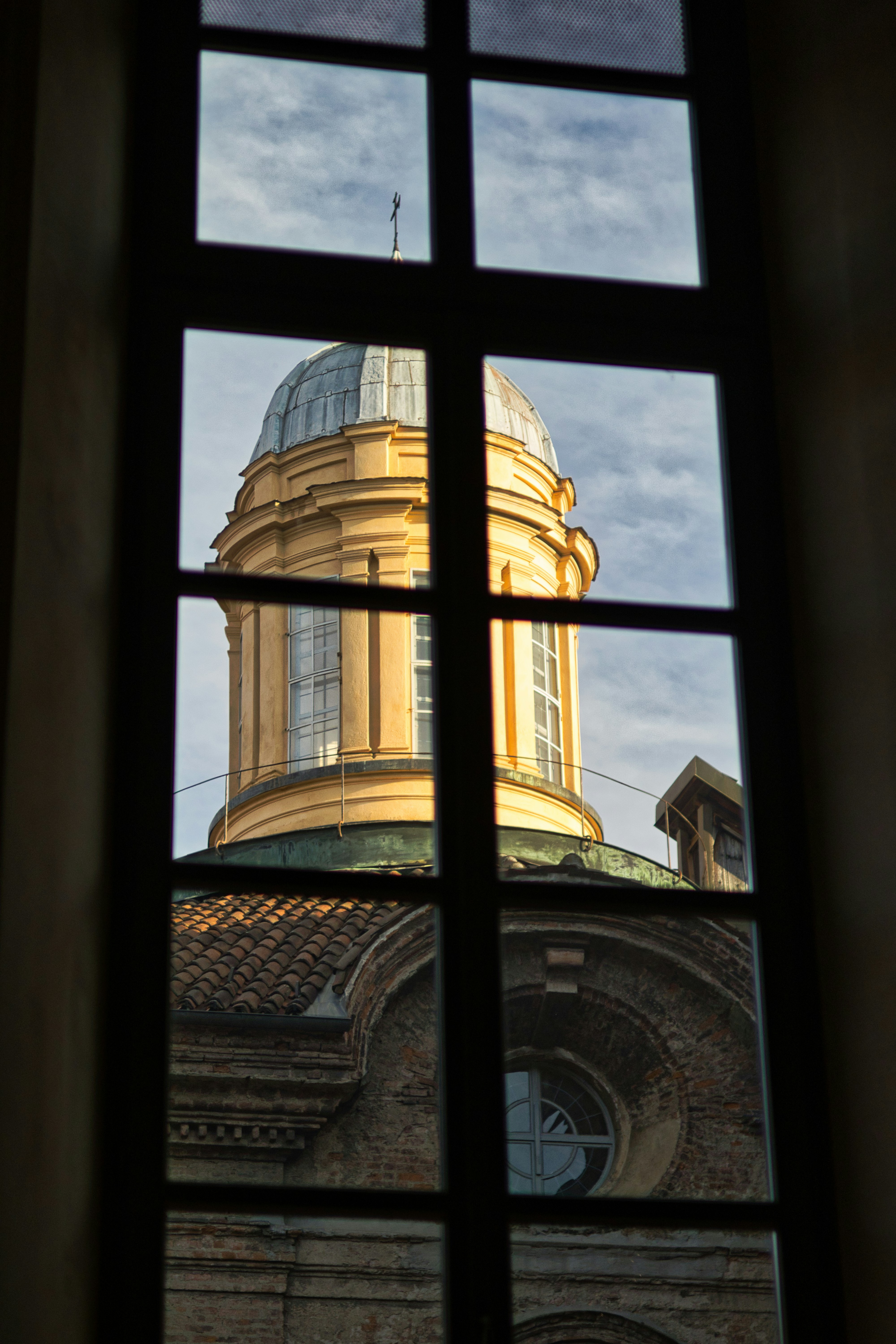 Dome through a Window: Architectural Vantage from a Narrow Frame