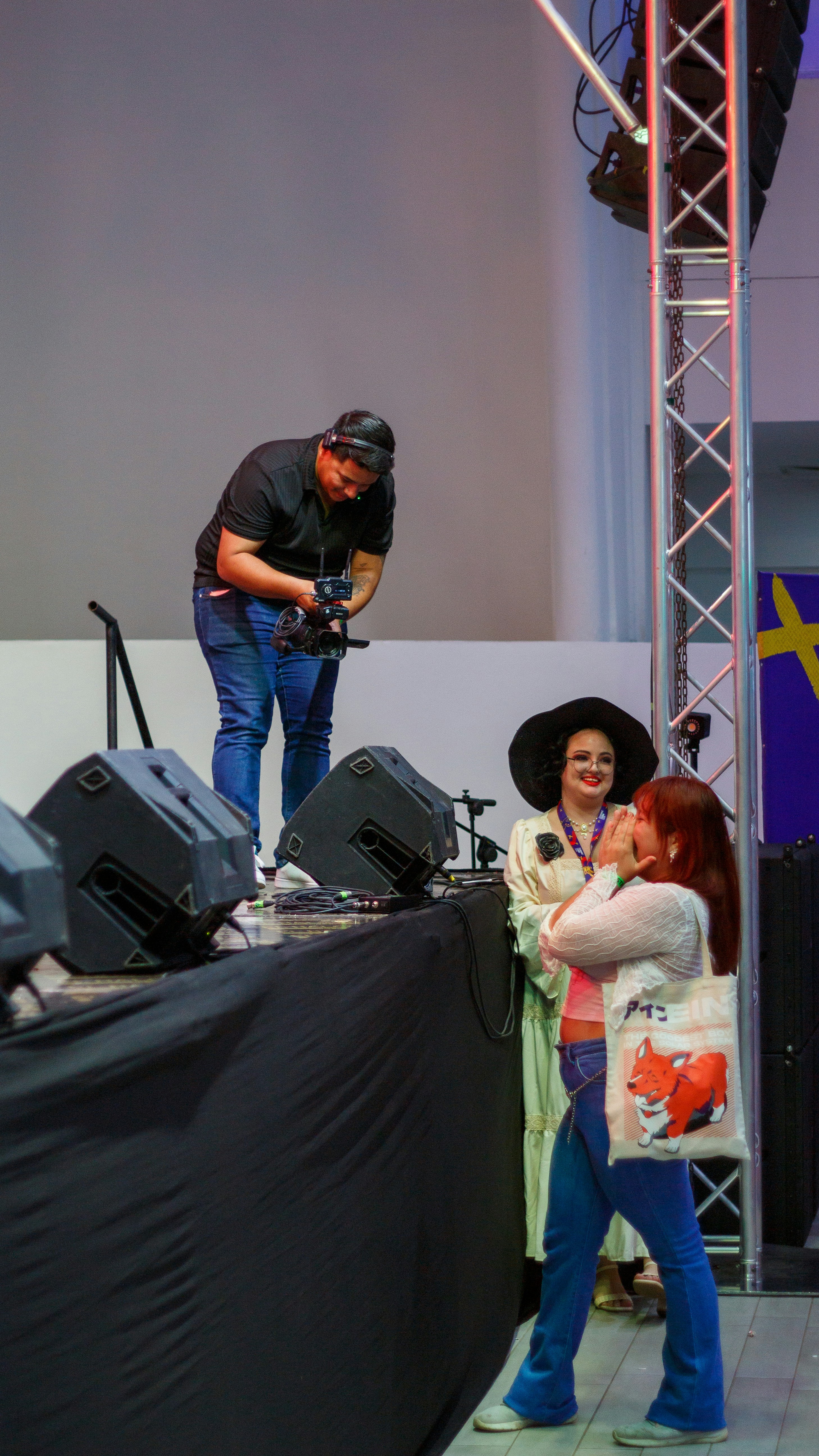 Stage Scout: The Cameraman Captures a Moment Behind the Barrier