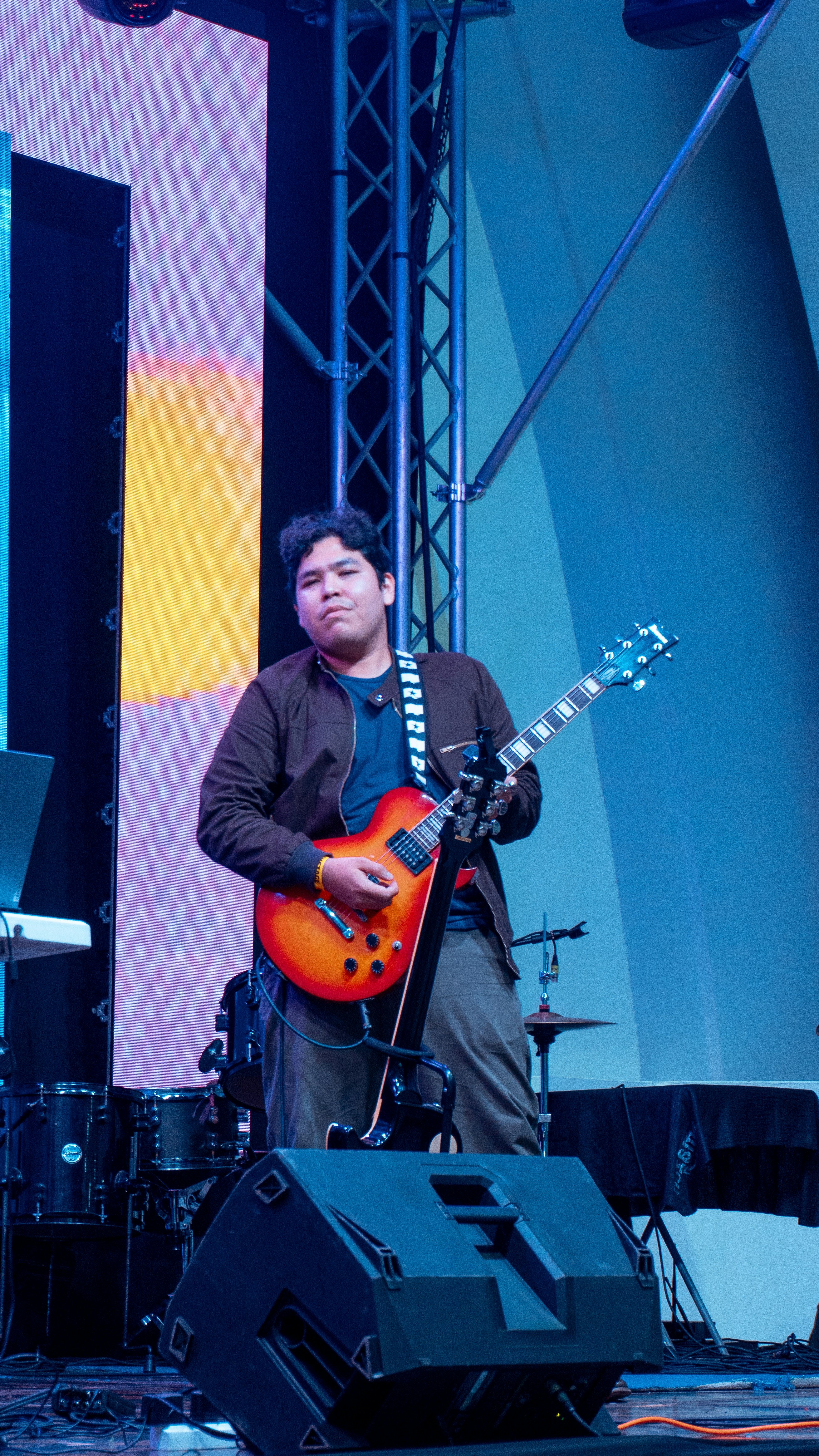 Sunlit Strings: A Guitarist in the Neon Stage