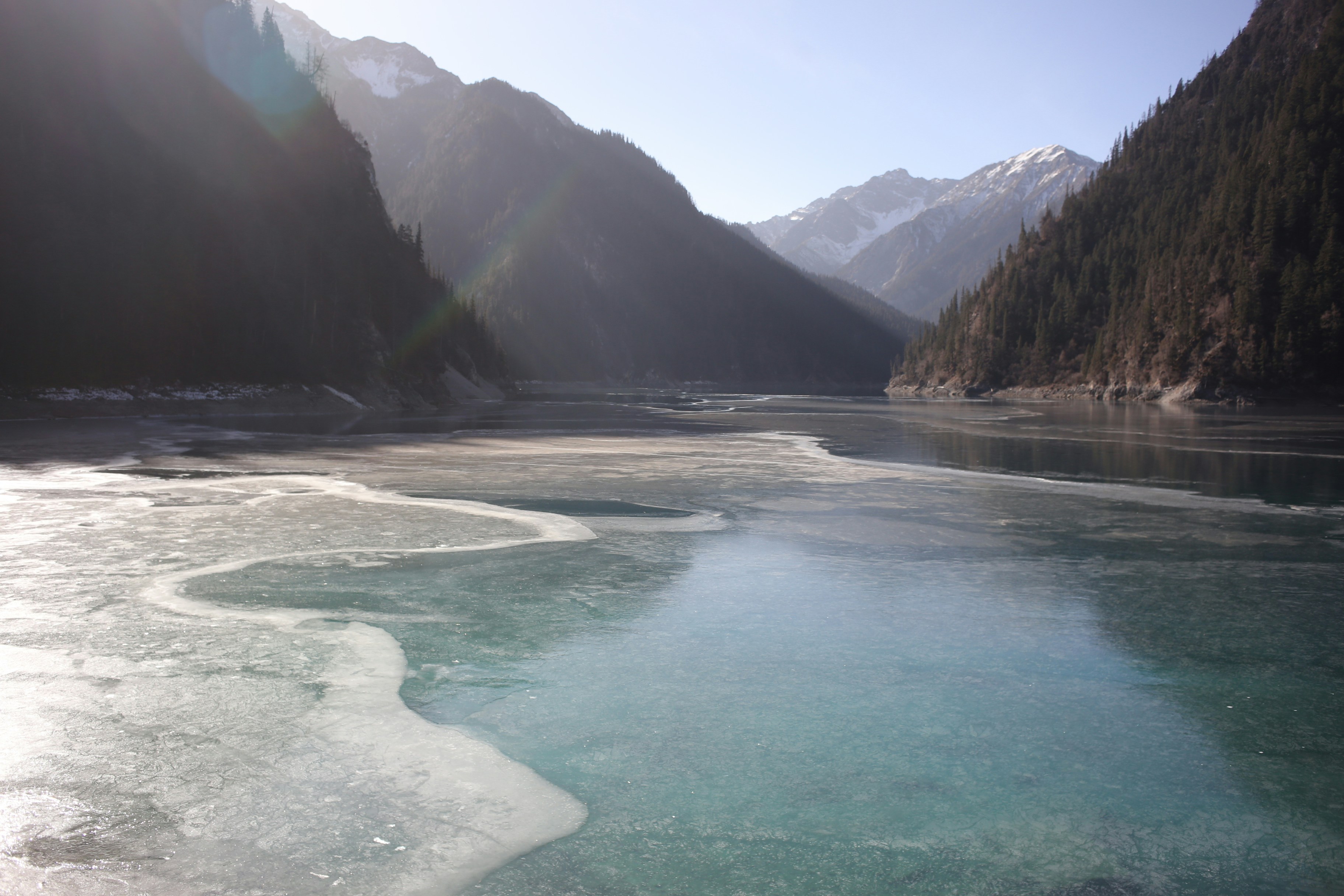 Glacial River Ledger: Sunlit Fjord Ice and Mountain Echoes