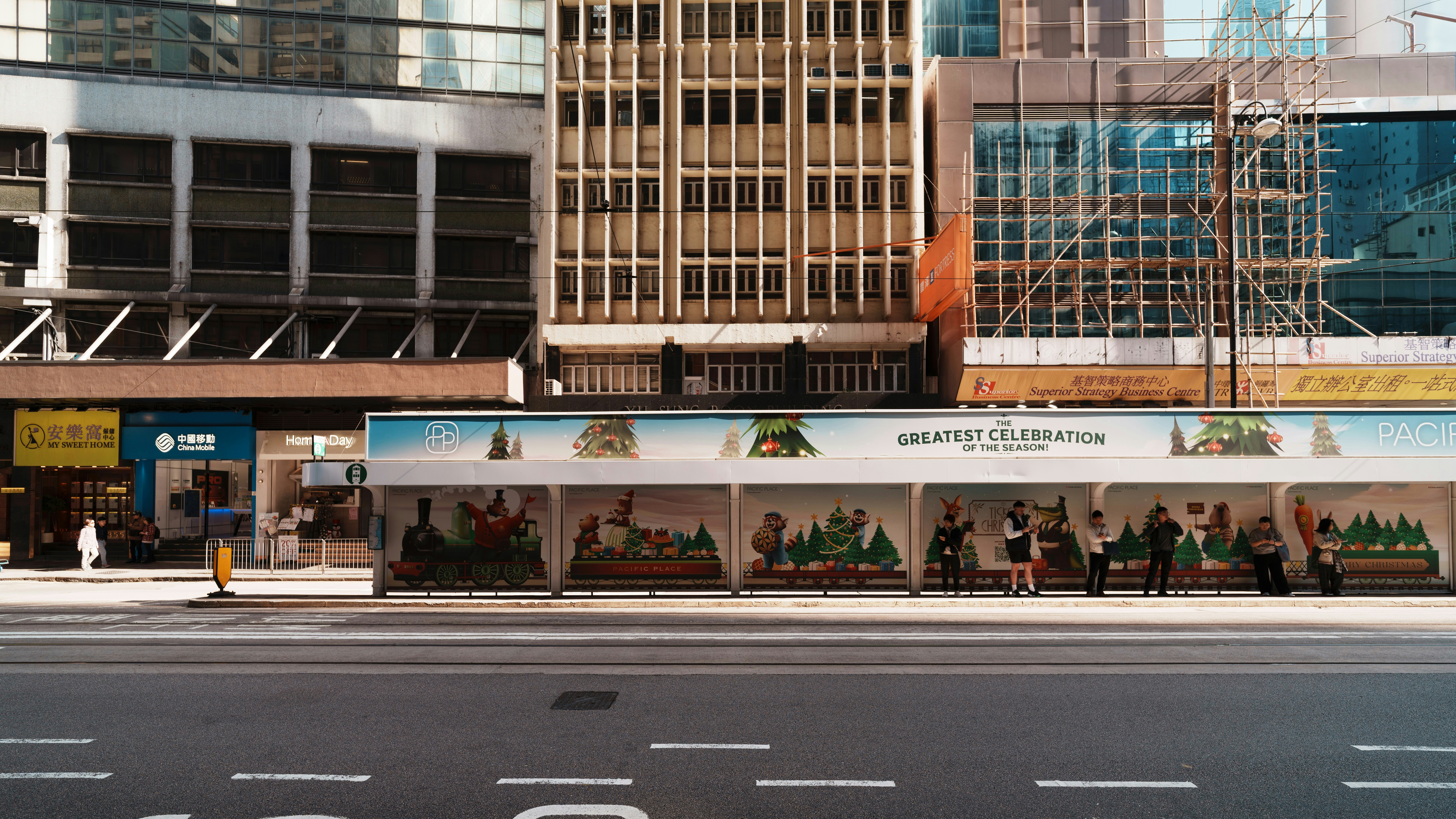 Construction of a Cityscape: Bannered Stallfronts under Glass Towers