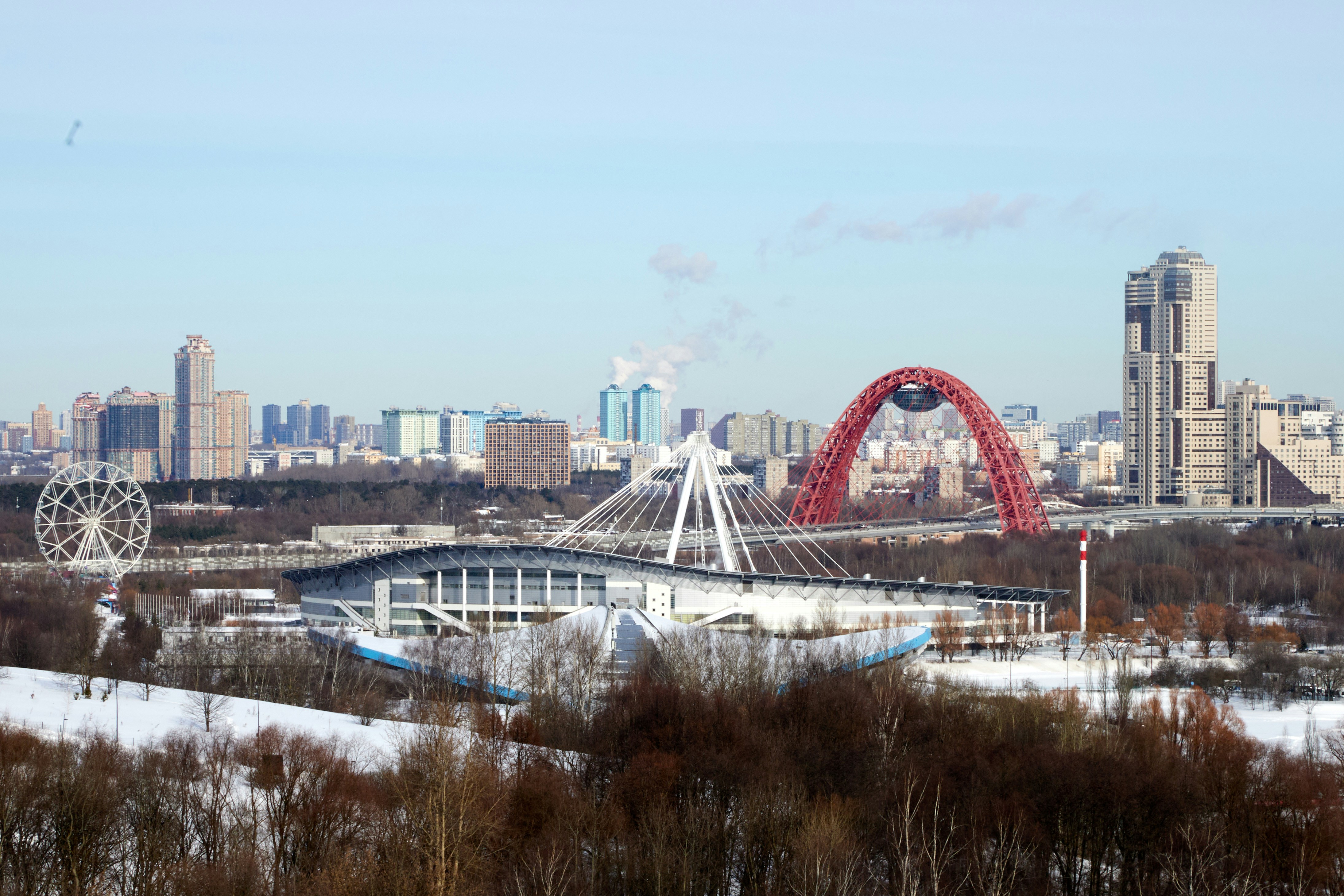 Bridge Over the Winter City: Arch Reds and Skyline