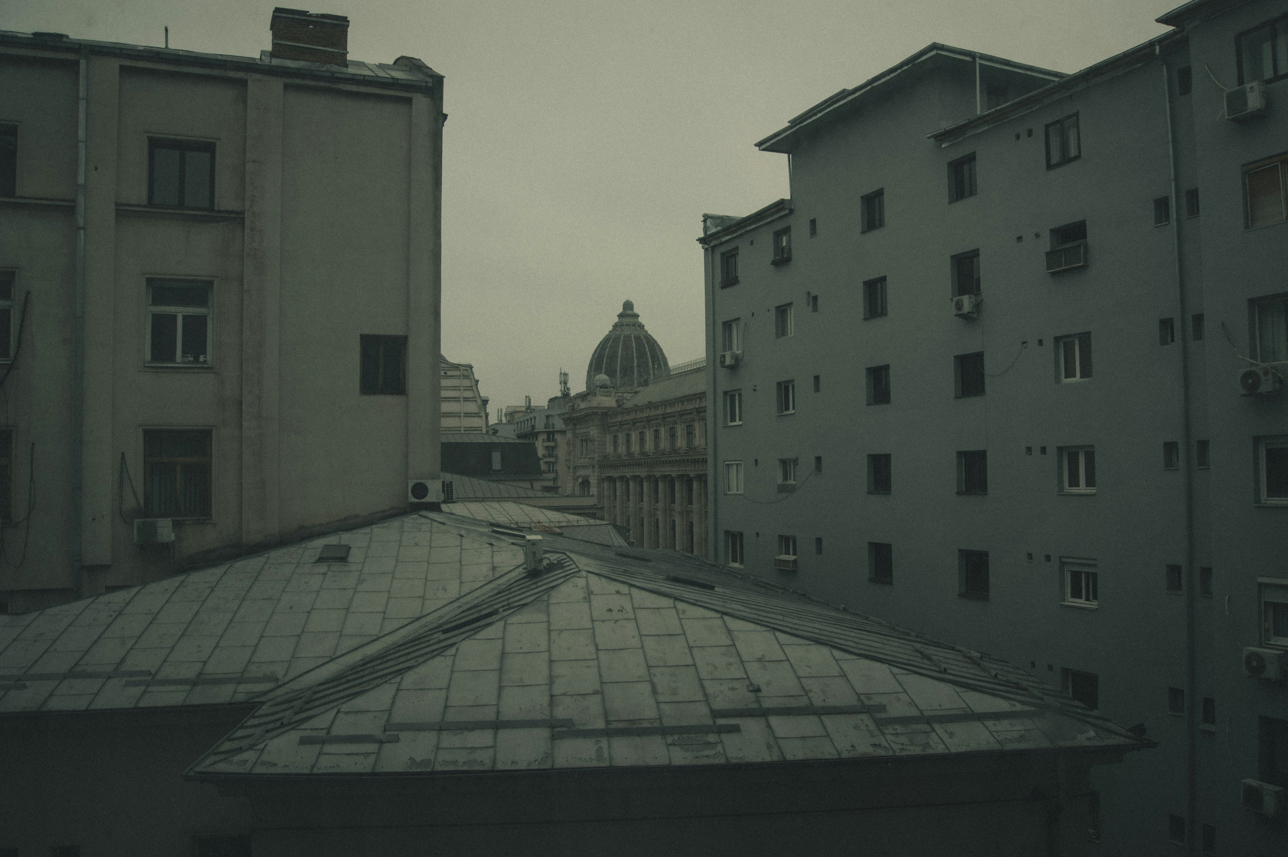 Dome and Rooftops: A Quiet City Corridor