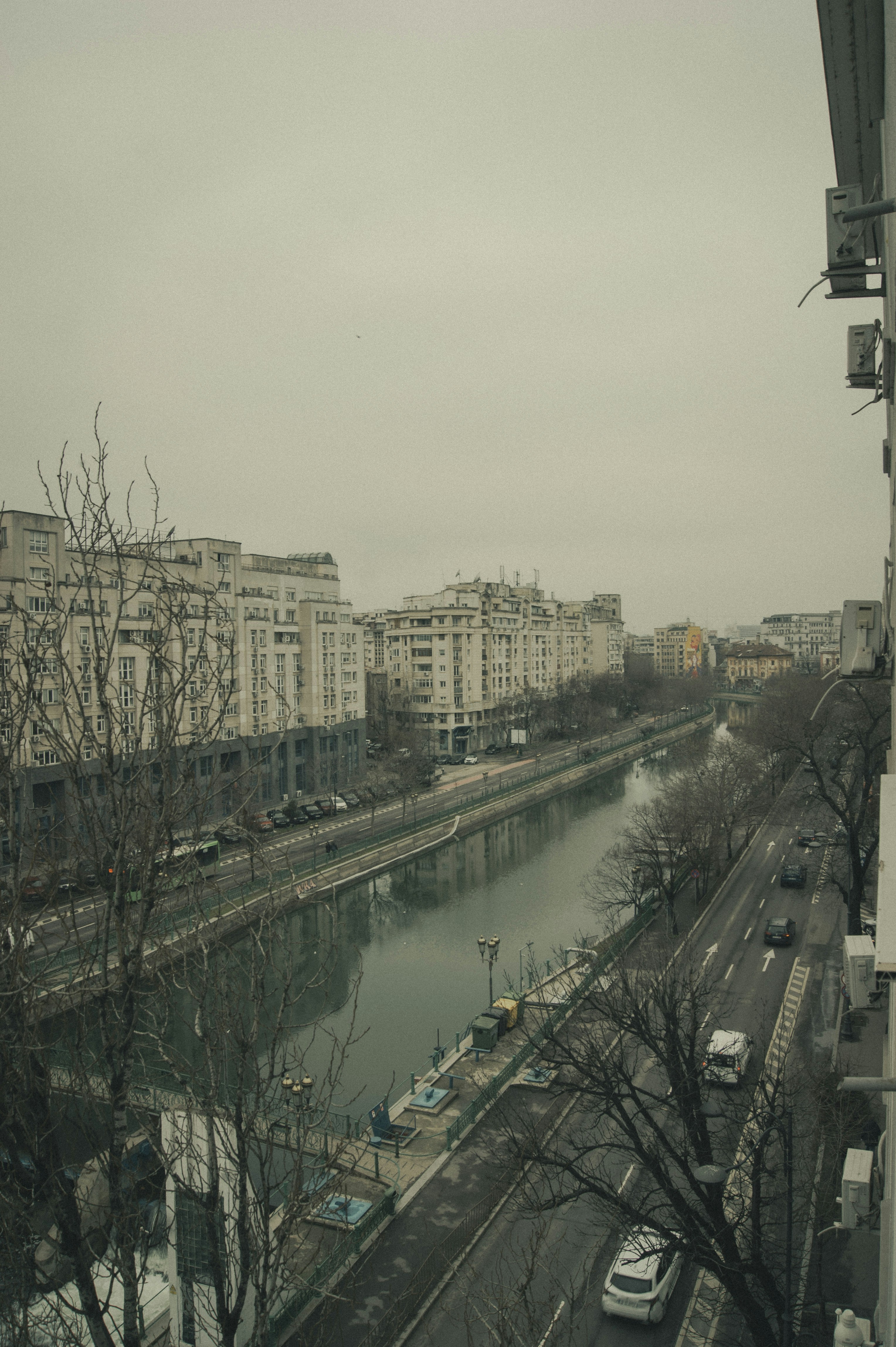 Canal Corridor Between Buildings on a Gray Day