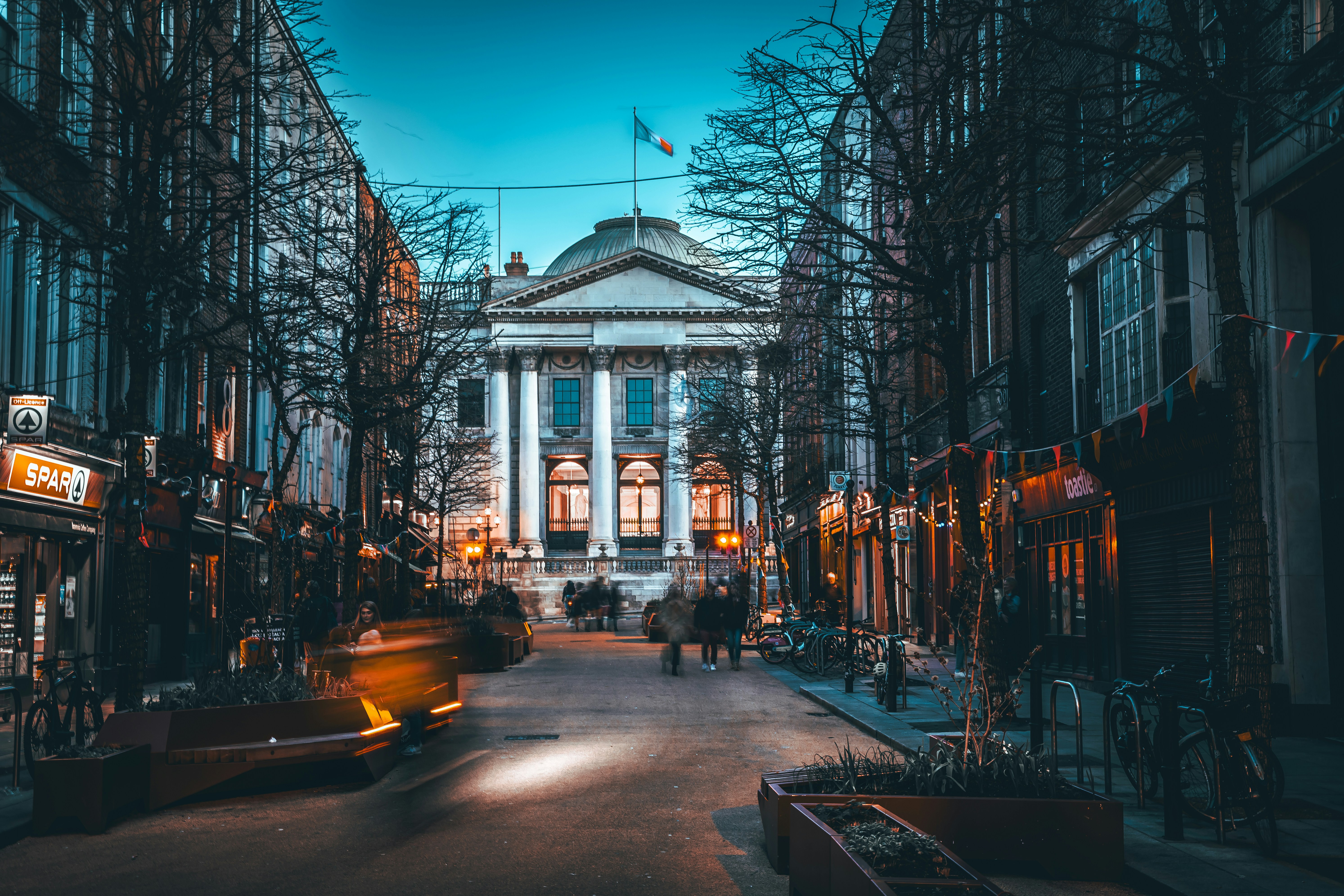 Evening Pediment: A European Street Leading to a Classical Courthouse