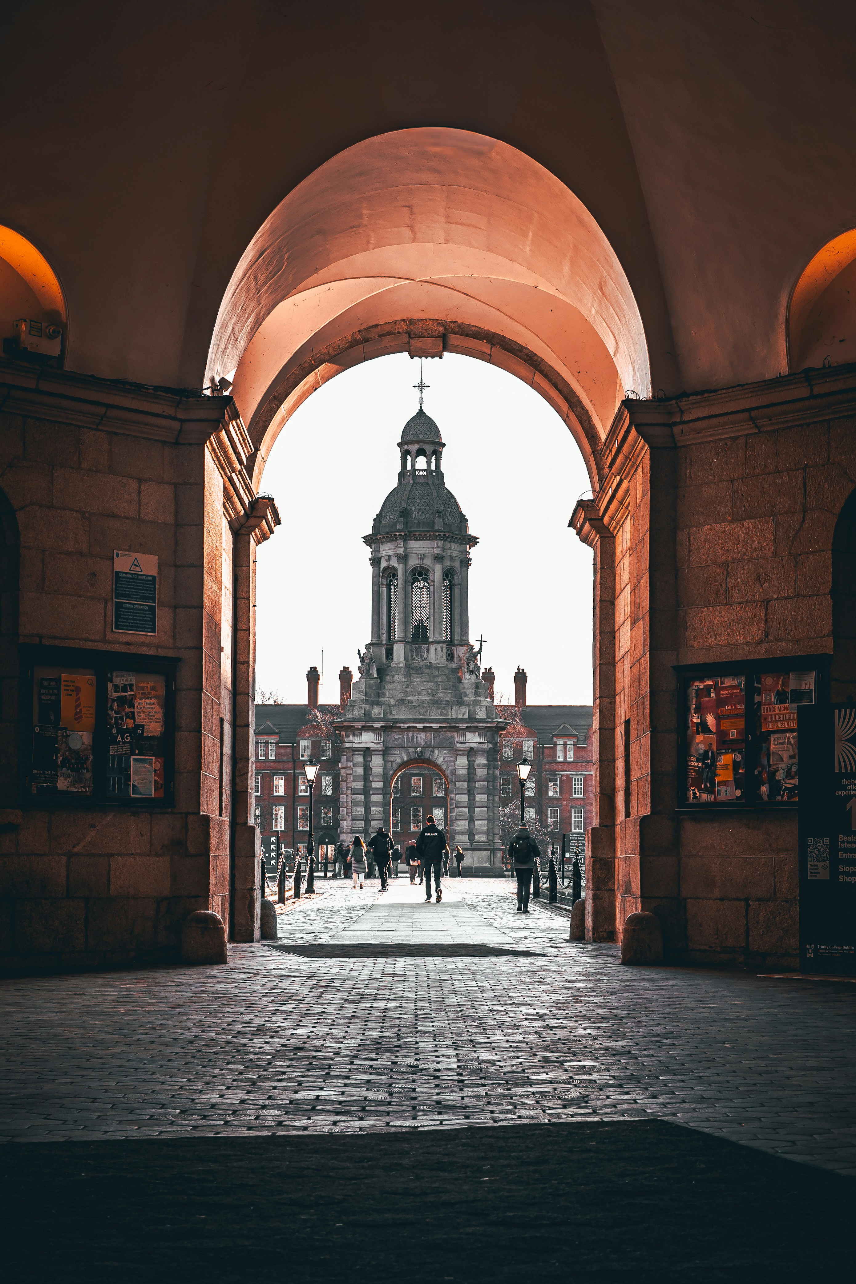 Archway to the Square: Central Clock Tower Framed by Courtyard Arches