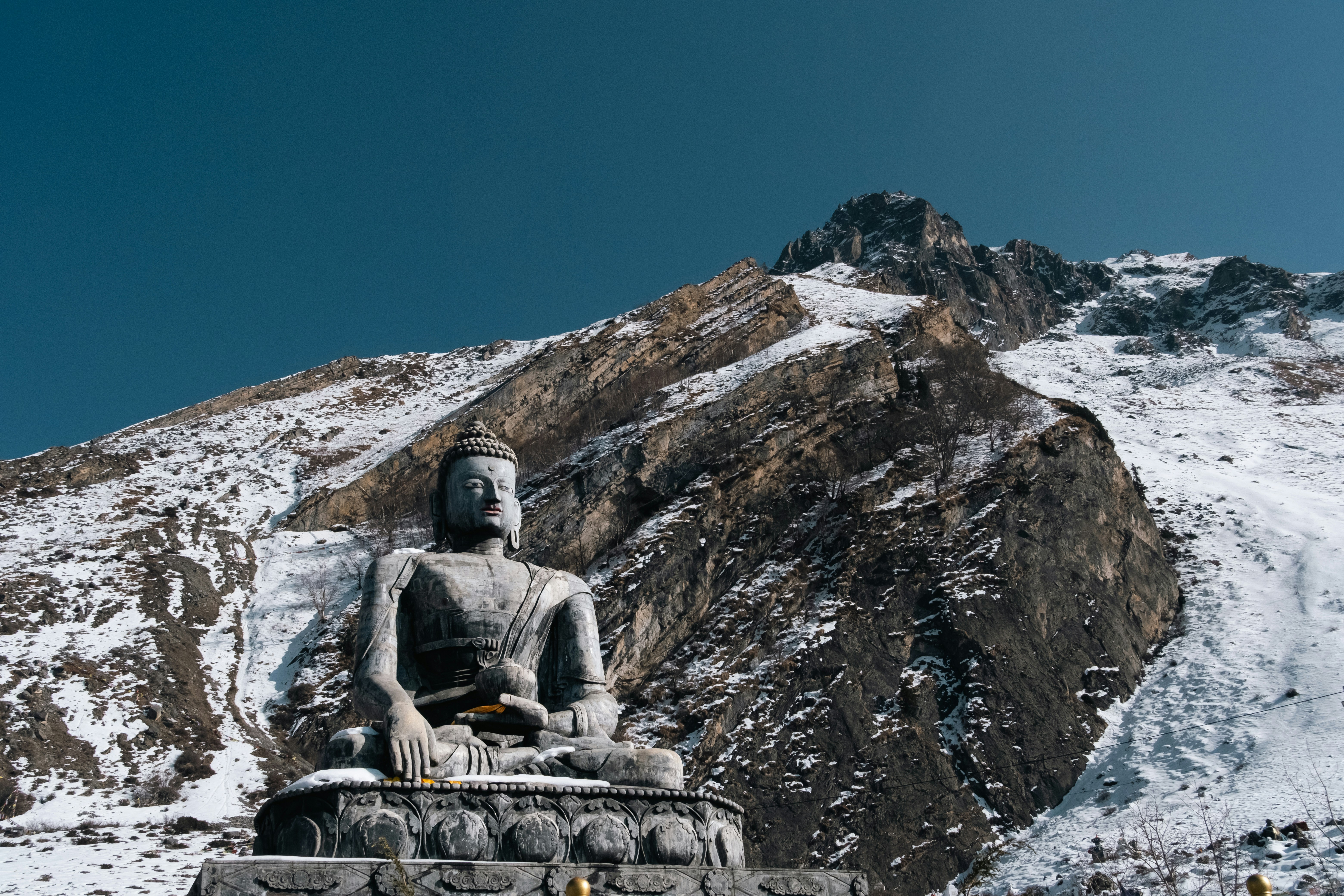 Buddha at Distant Spine: A Stone Silence above Snow