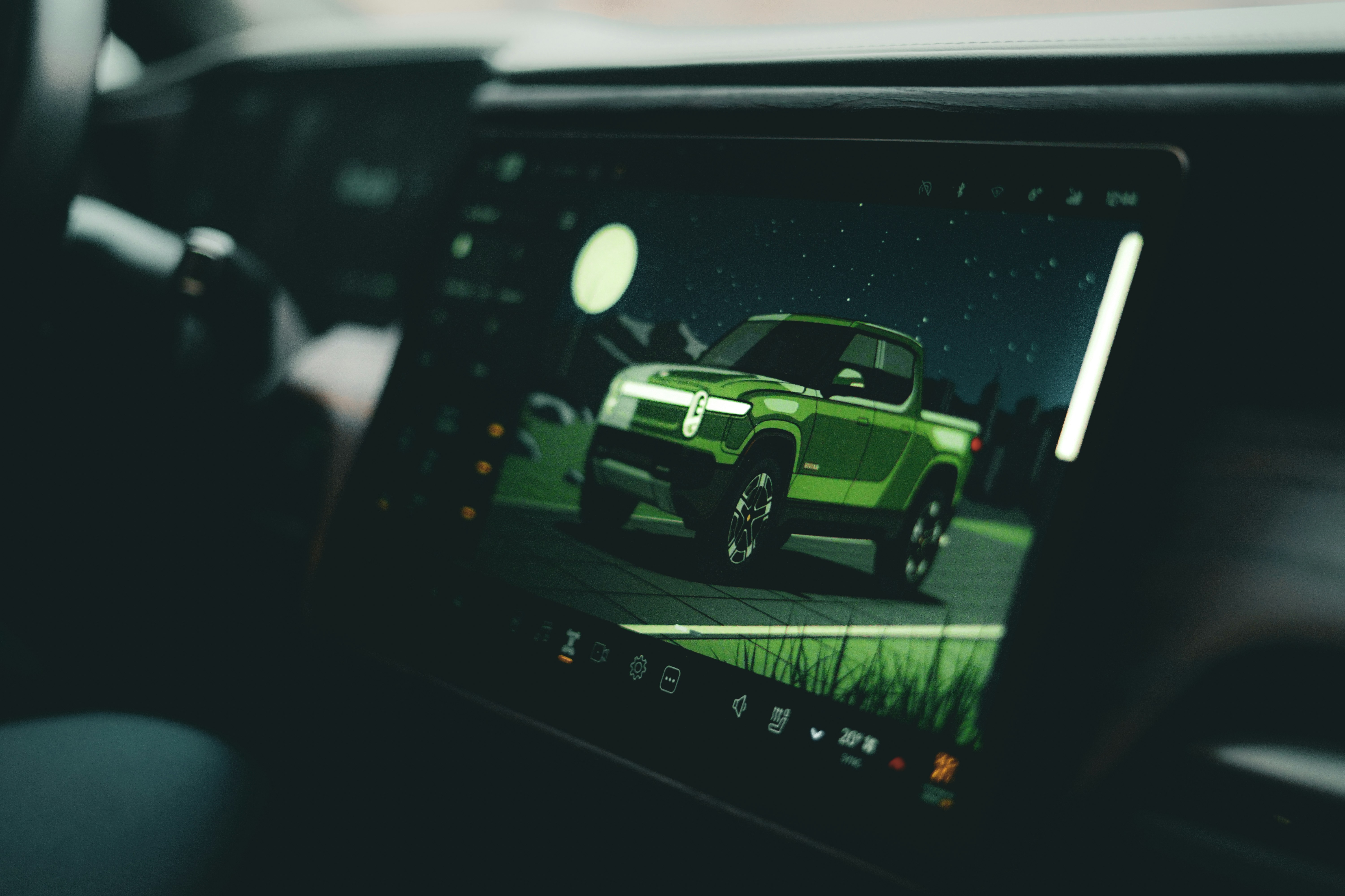 Night Drive: Green Pickup Illuminated by Infotainment Glow