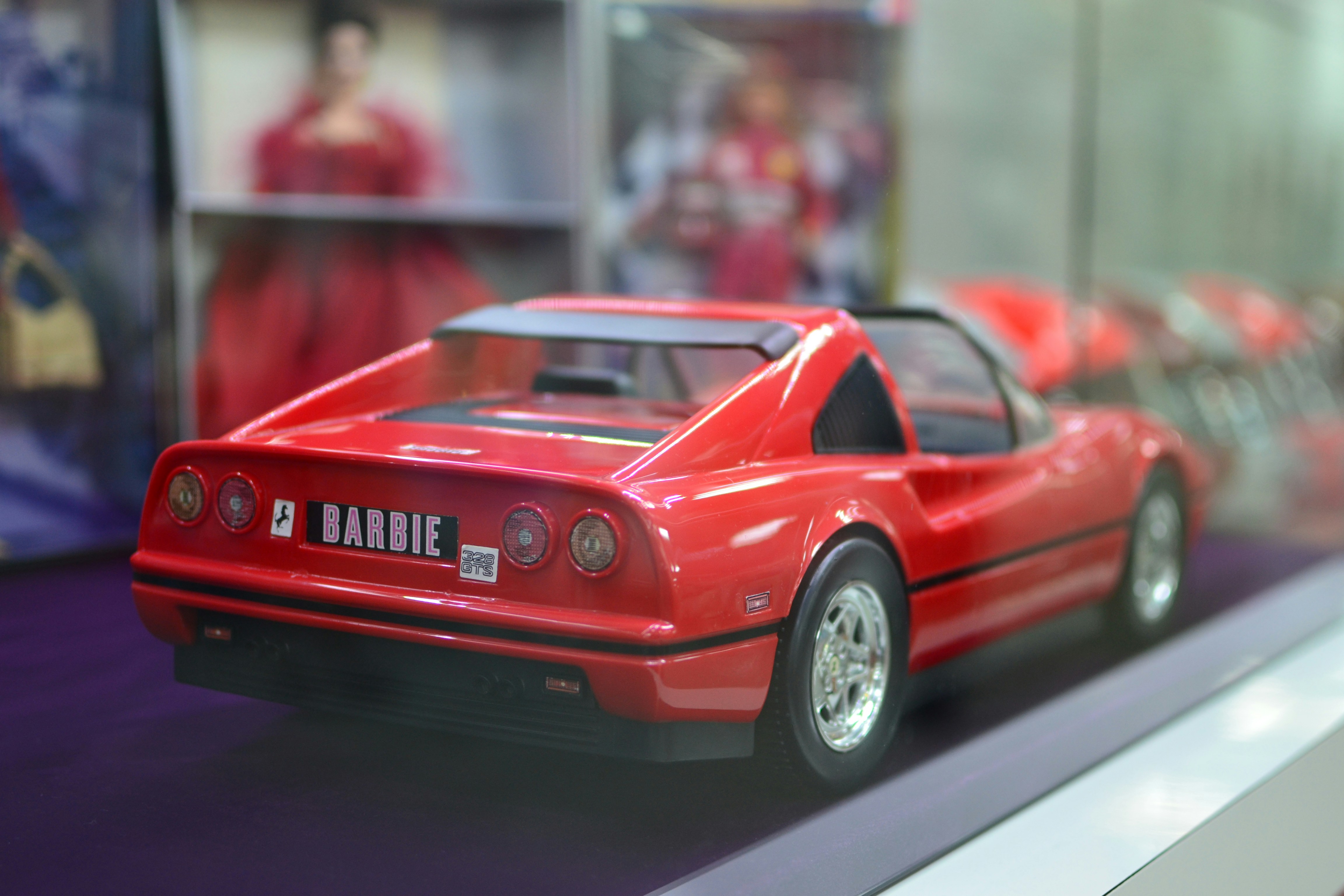 Barbie’s Red Dream Car: A Miniature Spotlight on a Shiny Convertible