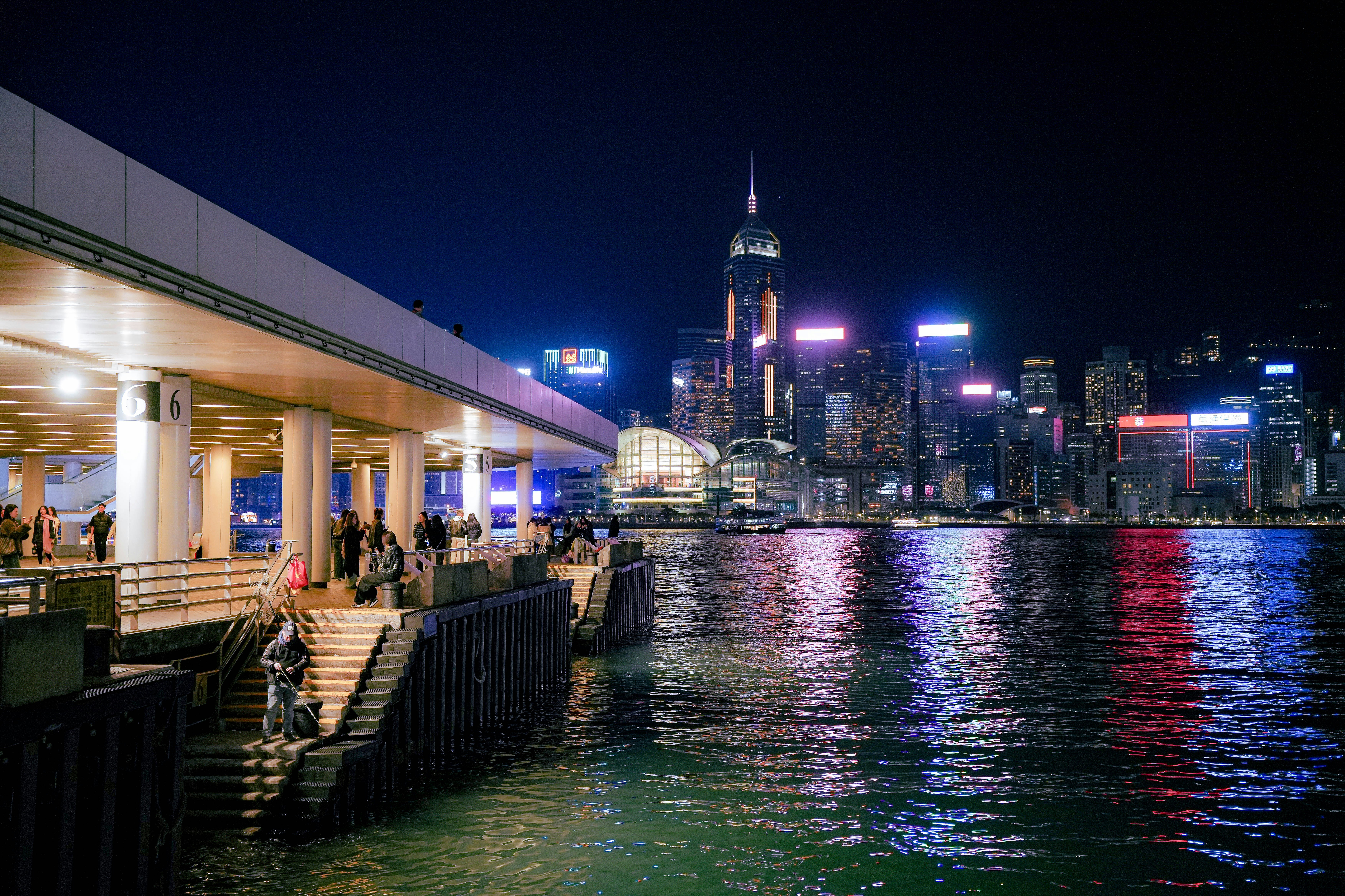Neon Harbor After Dark: Reflections Along the Waterfront Pier