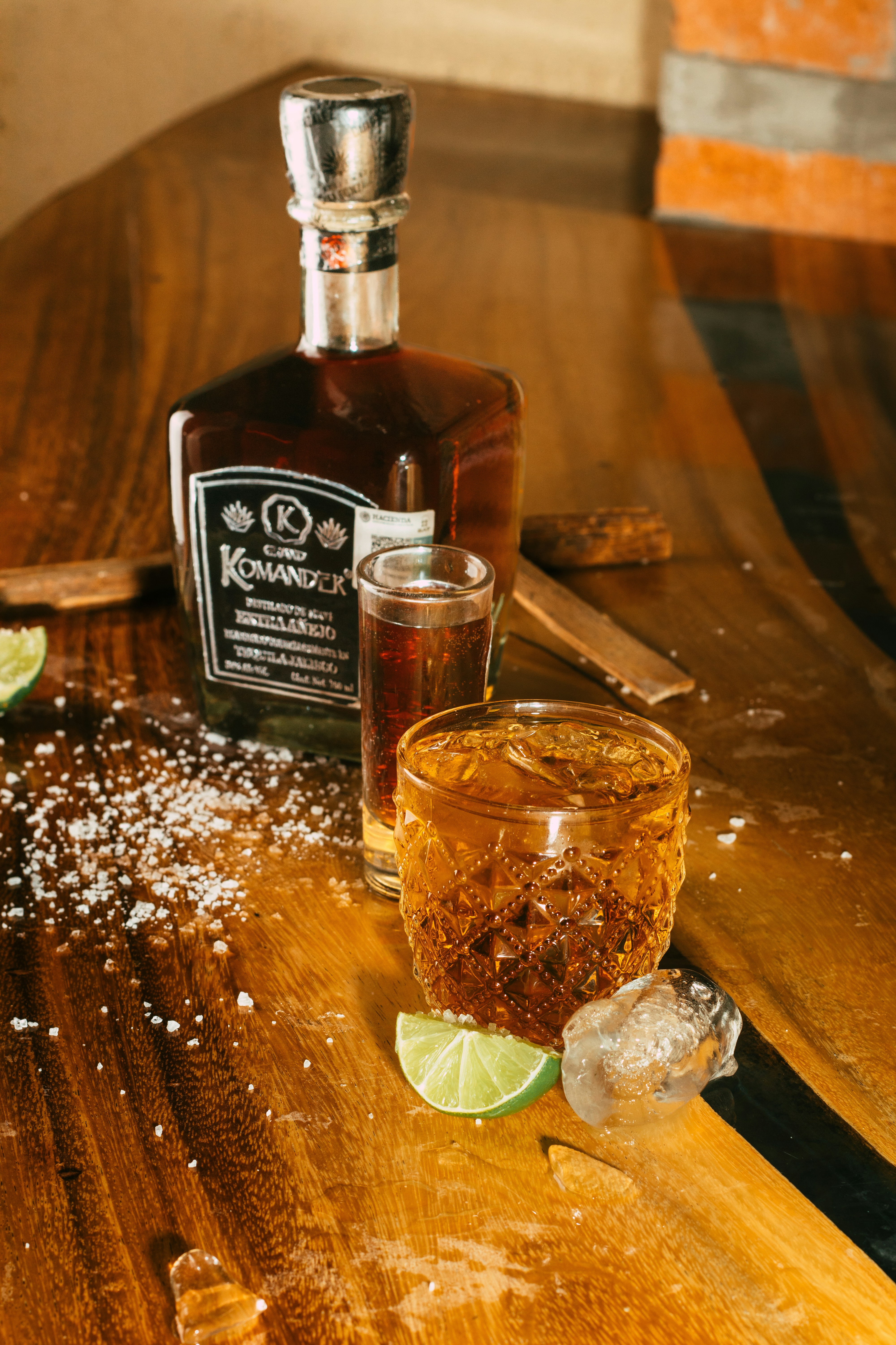 Amber Night: Whiskey, Lime, and Ice on a Wooden Stage