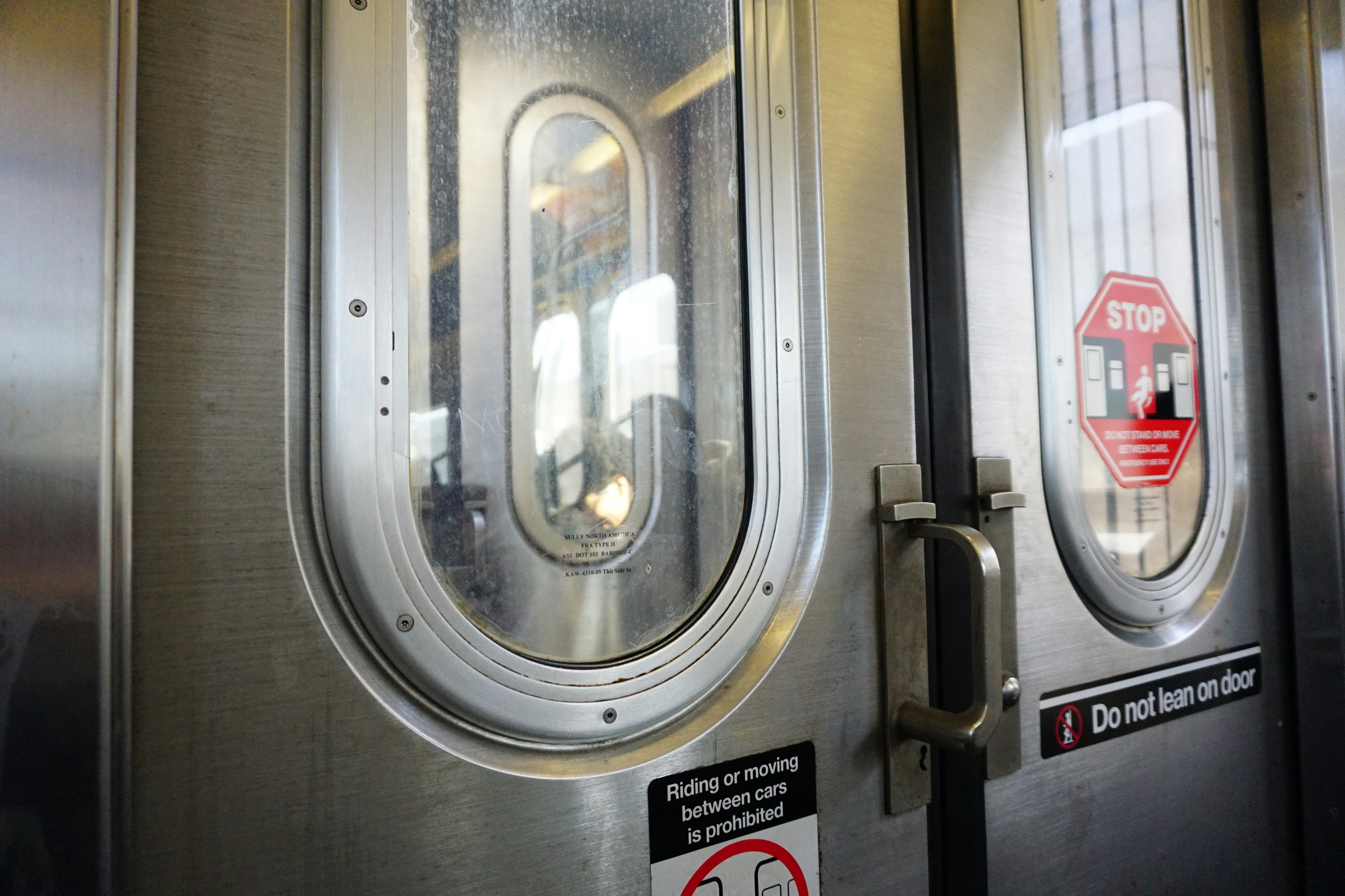Closed Doors, Quiet Moment: Subway Car Grasped in Stainless Steel Lines