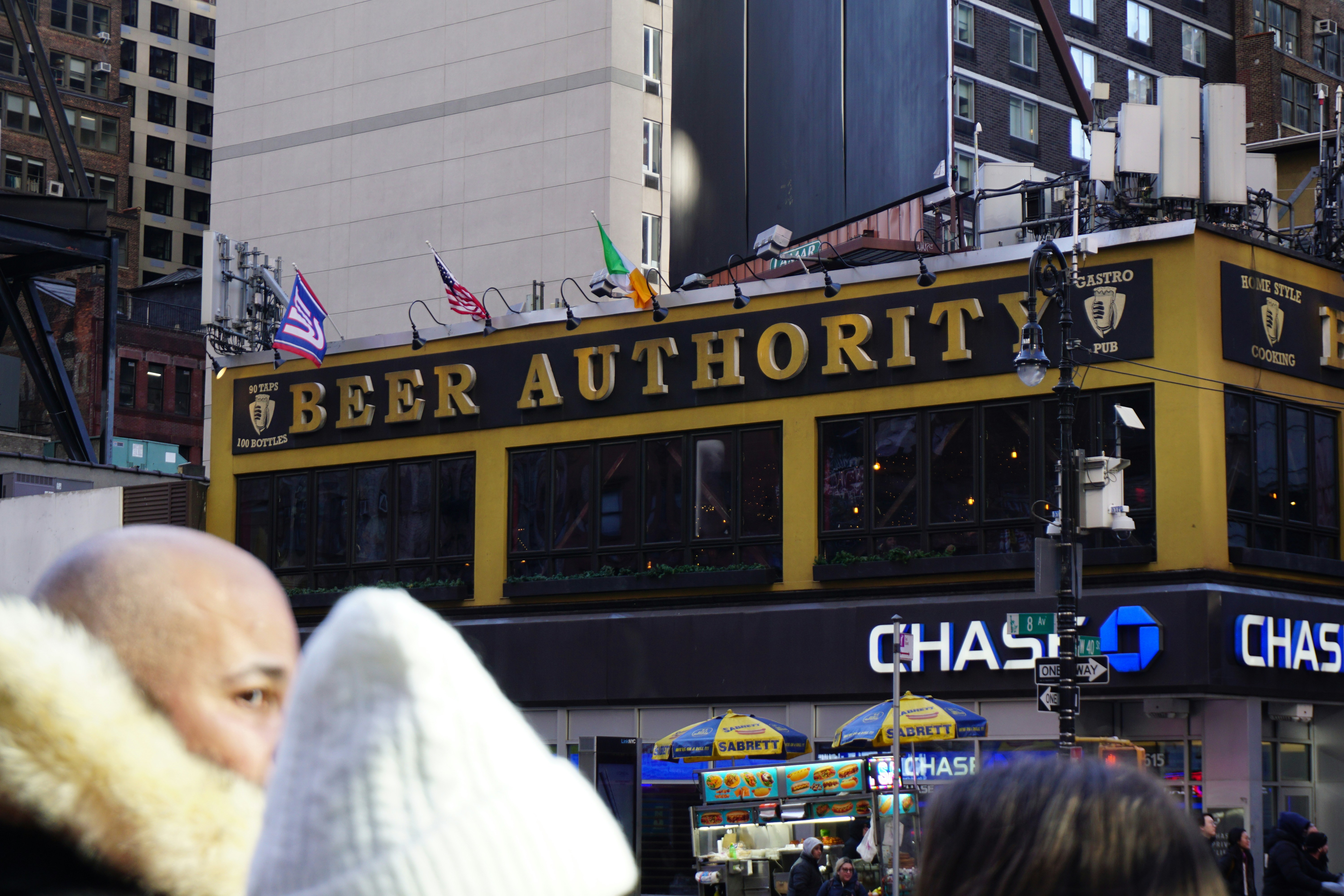 Bright Signage Over a Bustling Street Corner