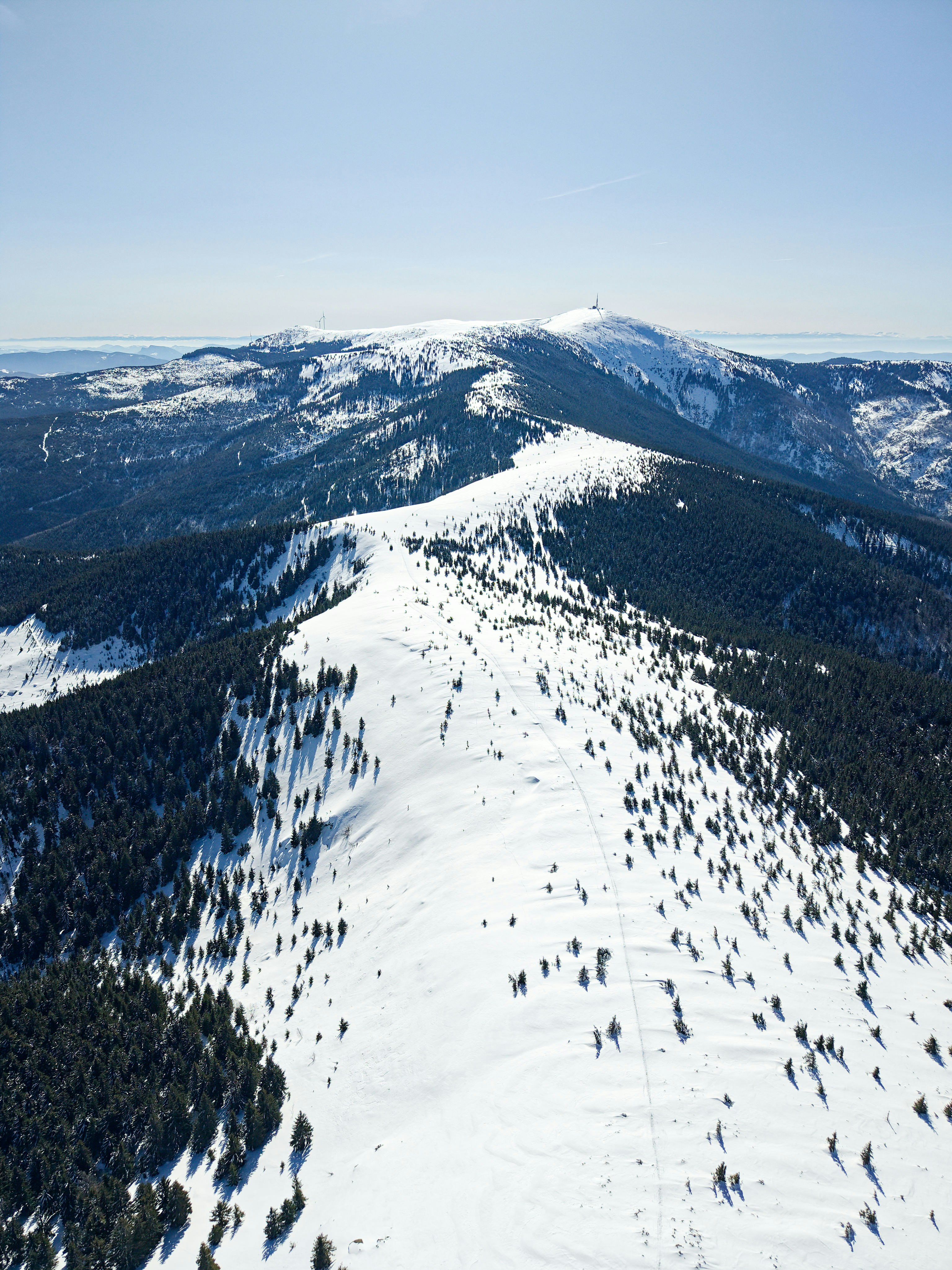 Snowbound Ridge: Aerial Canvas Above a Frosted Crest