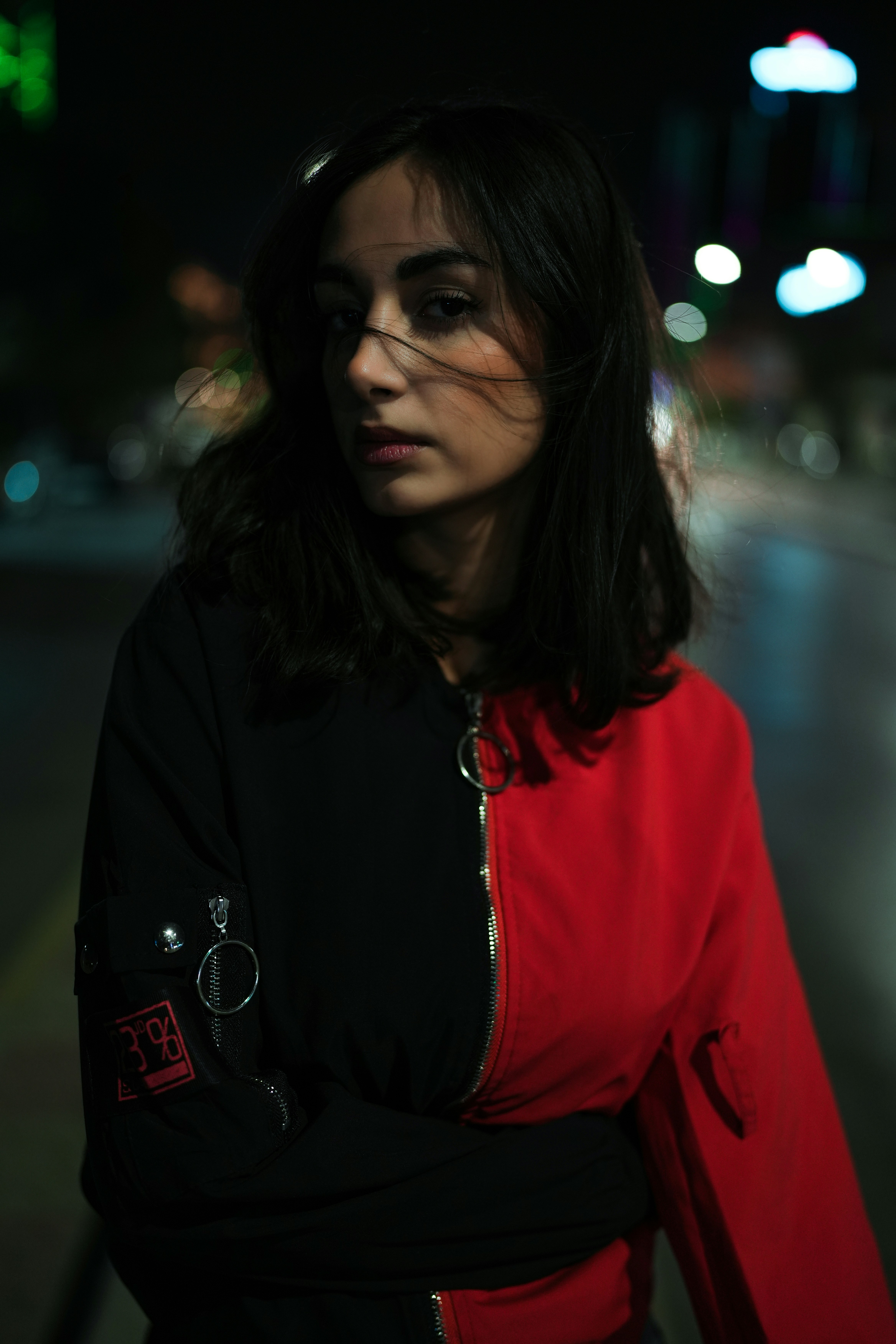 Neon Night Gaze in a Split-Red Jacket