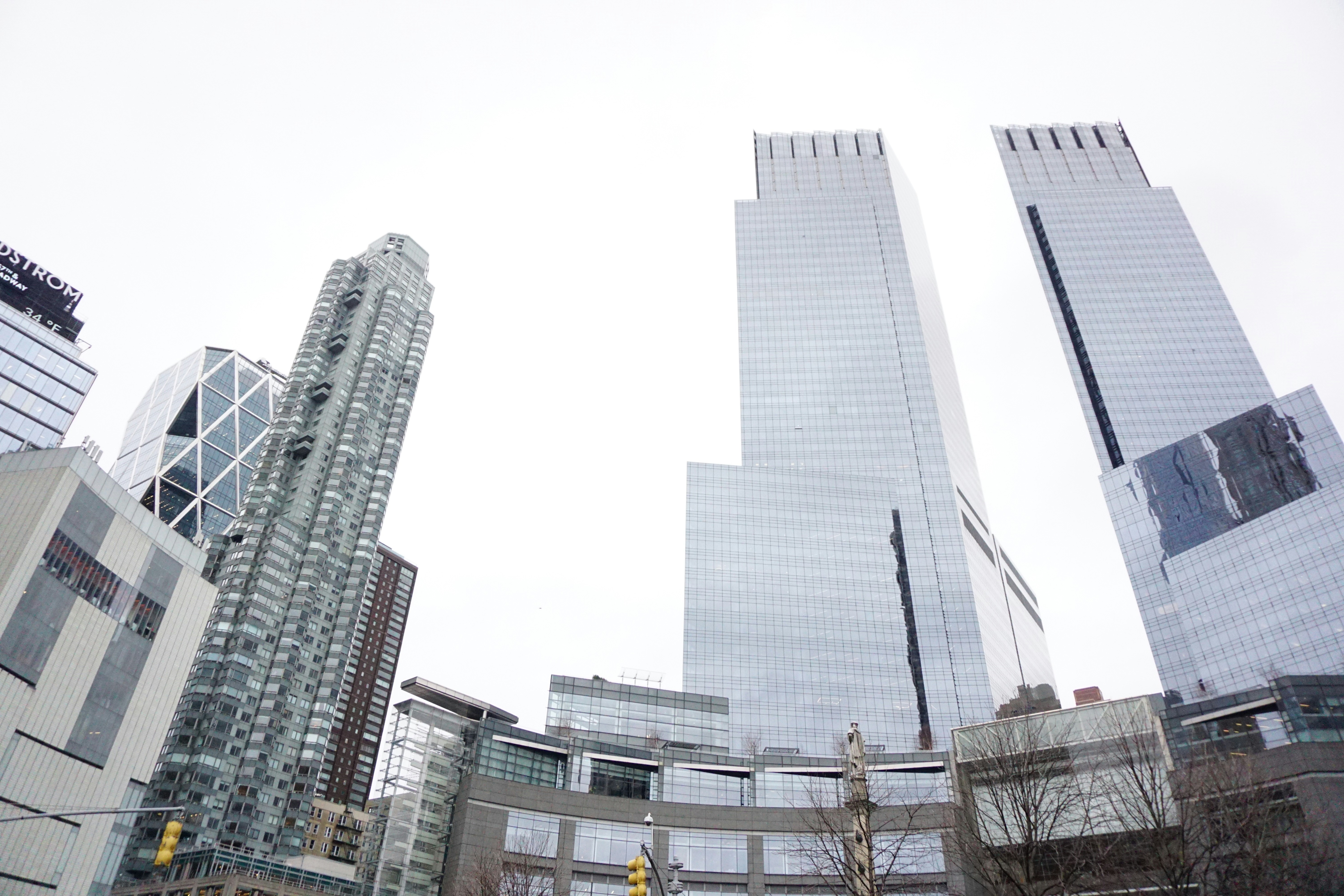 Skyline Symmetry: Glass Towers Rising Over a Wide Urban Plaza