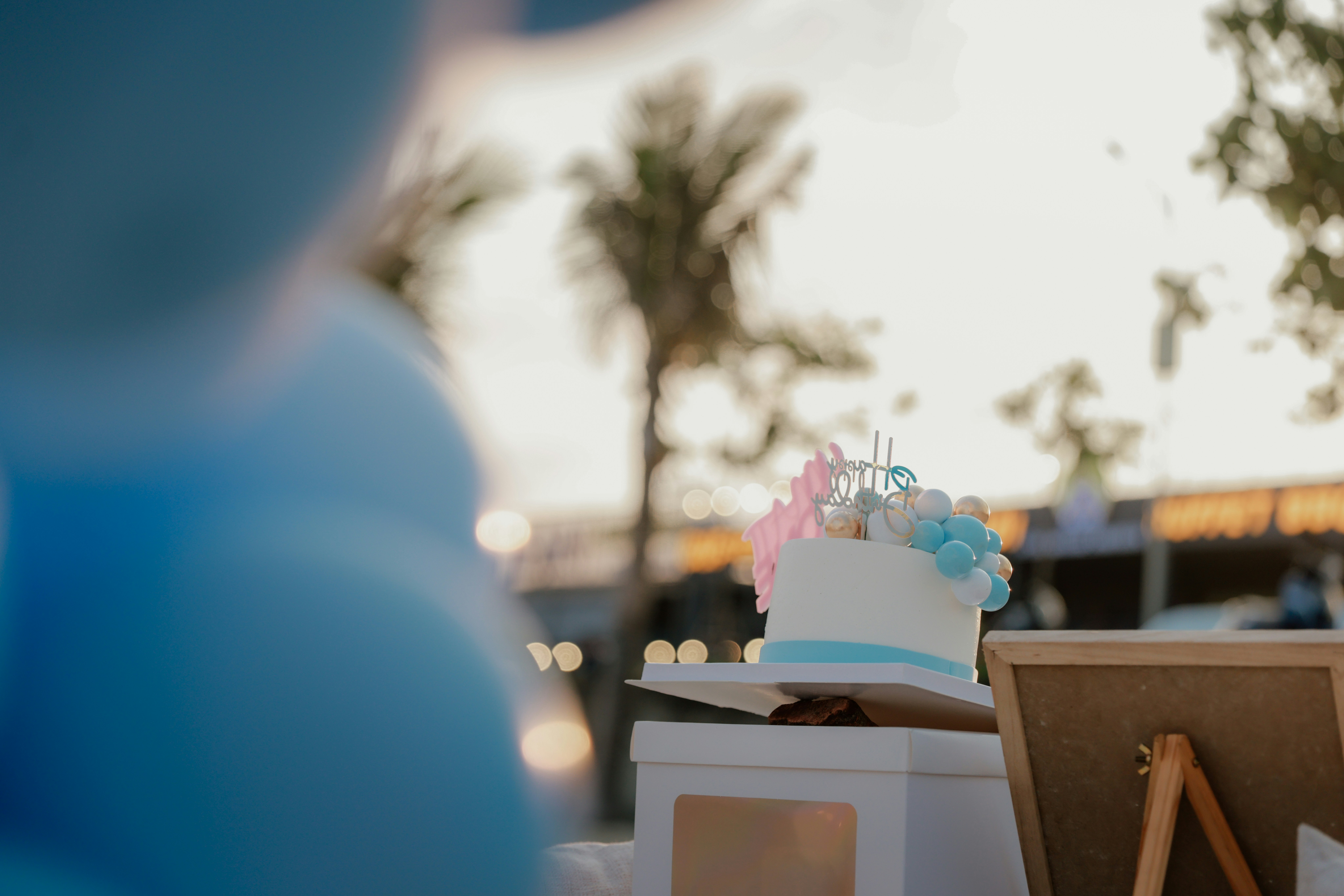 Sweet Celebration: A Cake in Focus at Sunset Event