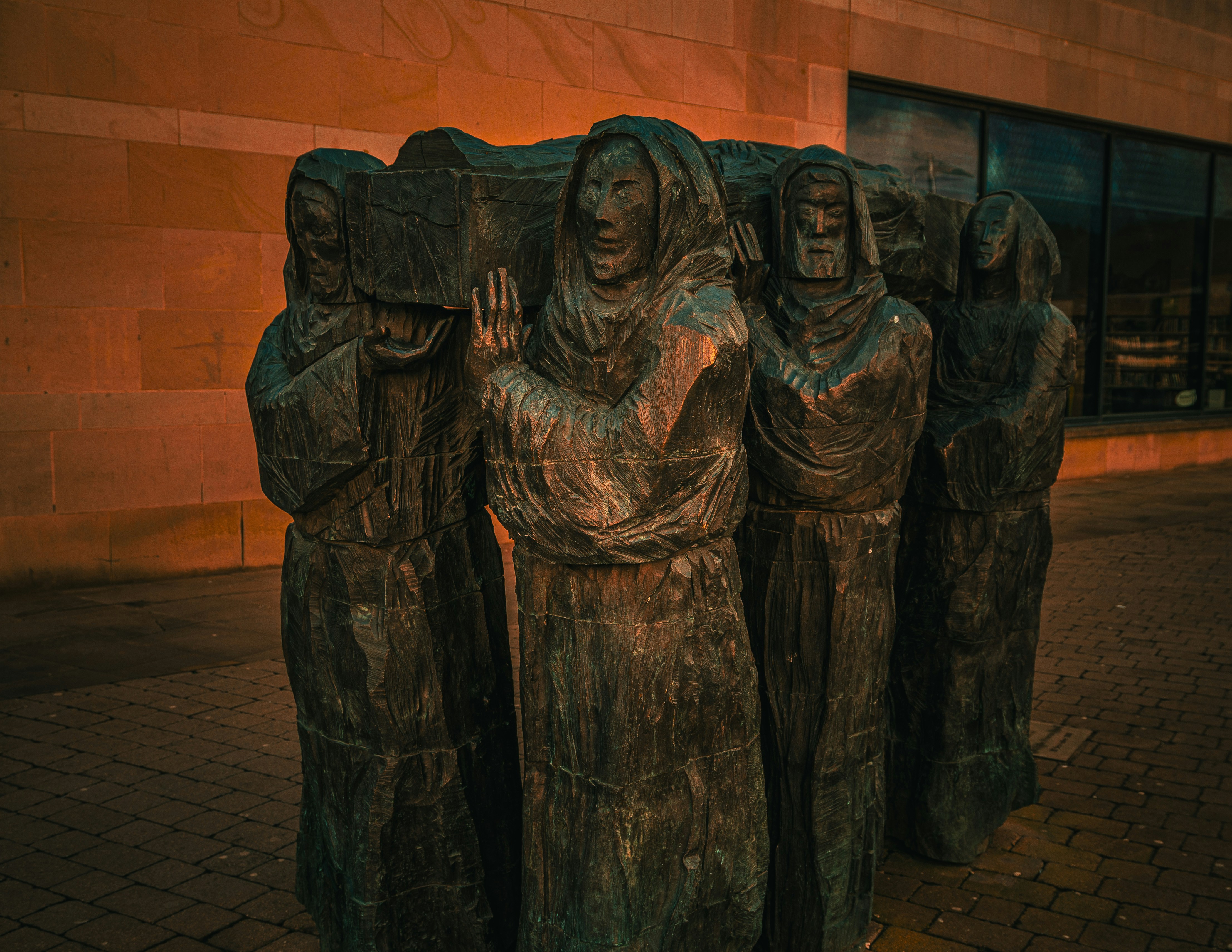 Muted Procession: Bronze Figures in Evening Light