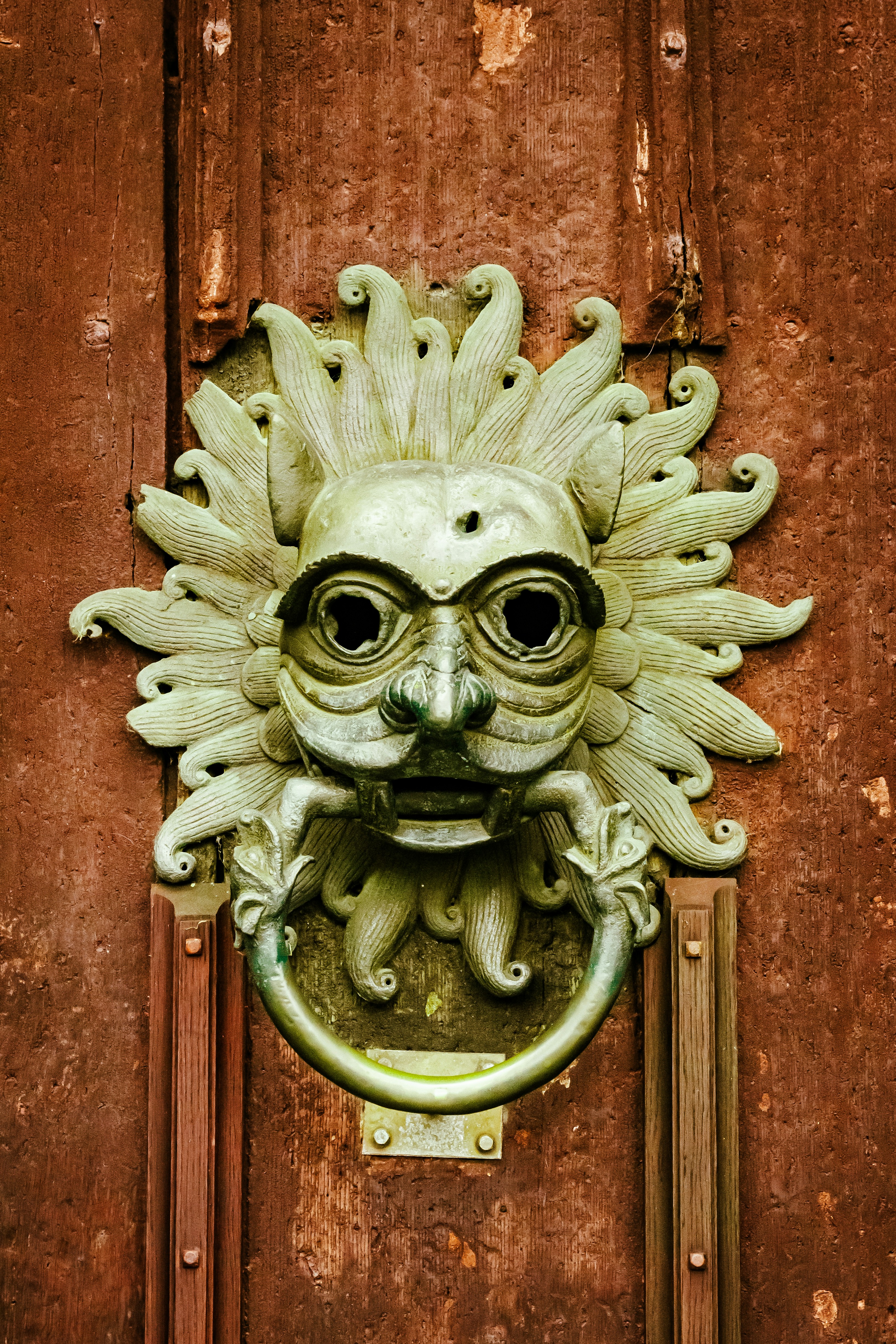 Sunburst Guardian: The Brass Door Knocker with a Stare