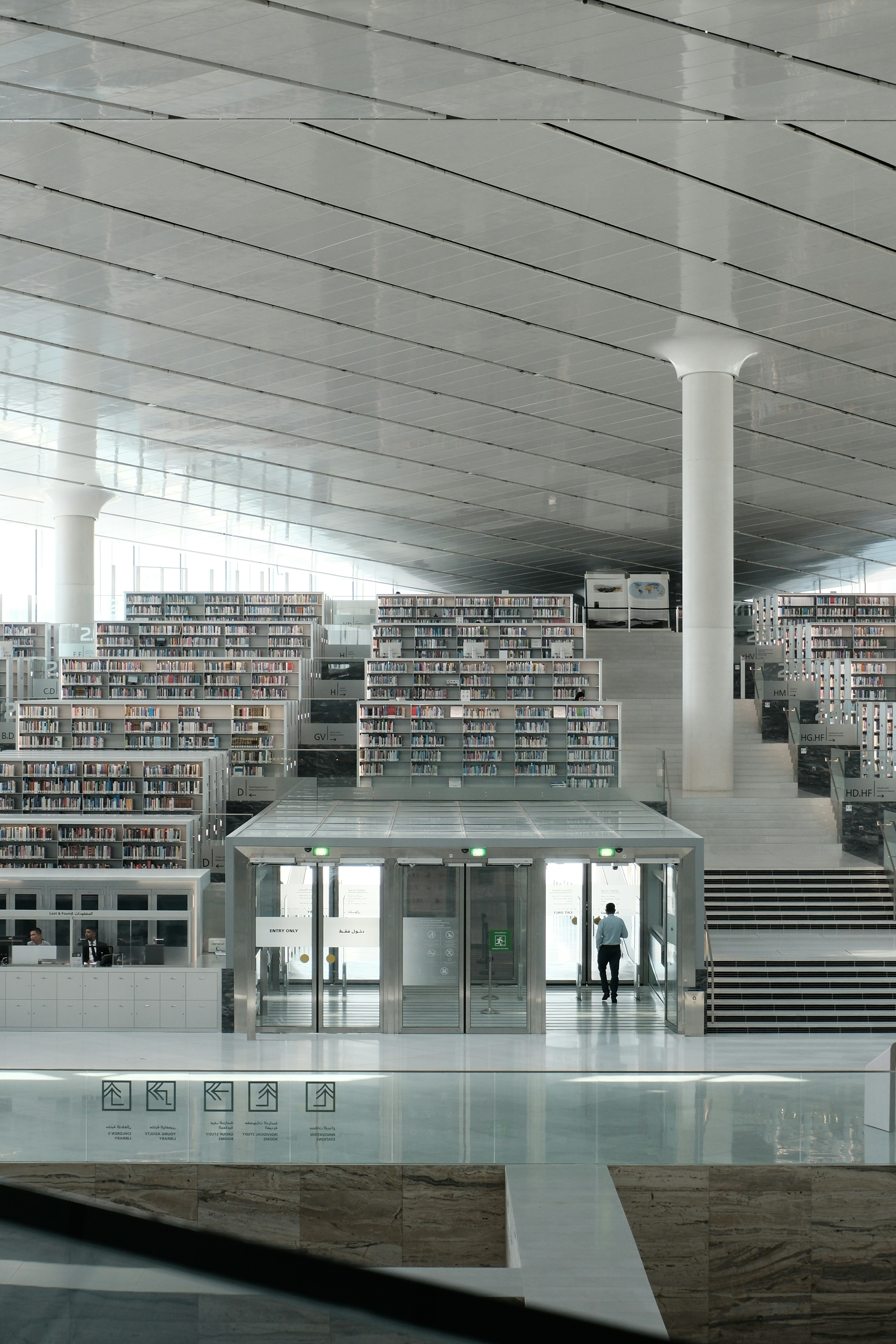 Silent Assembly: A Library Atrium Breathees Light and Steel