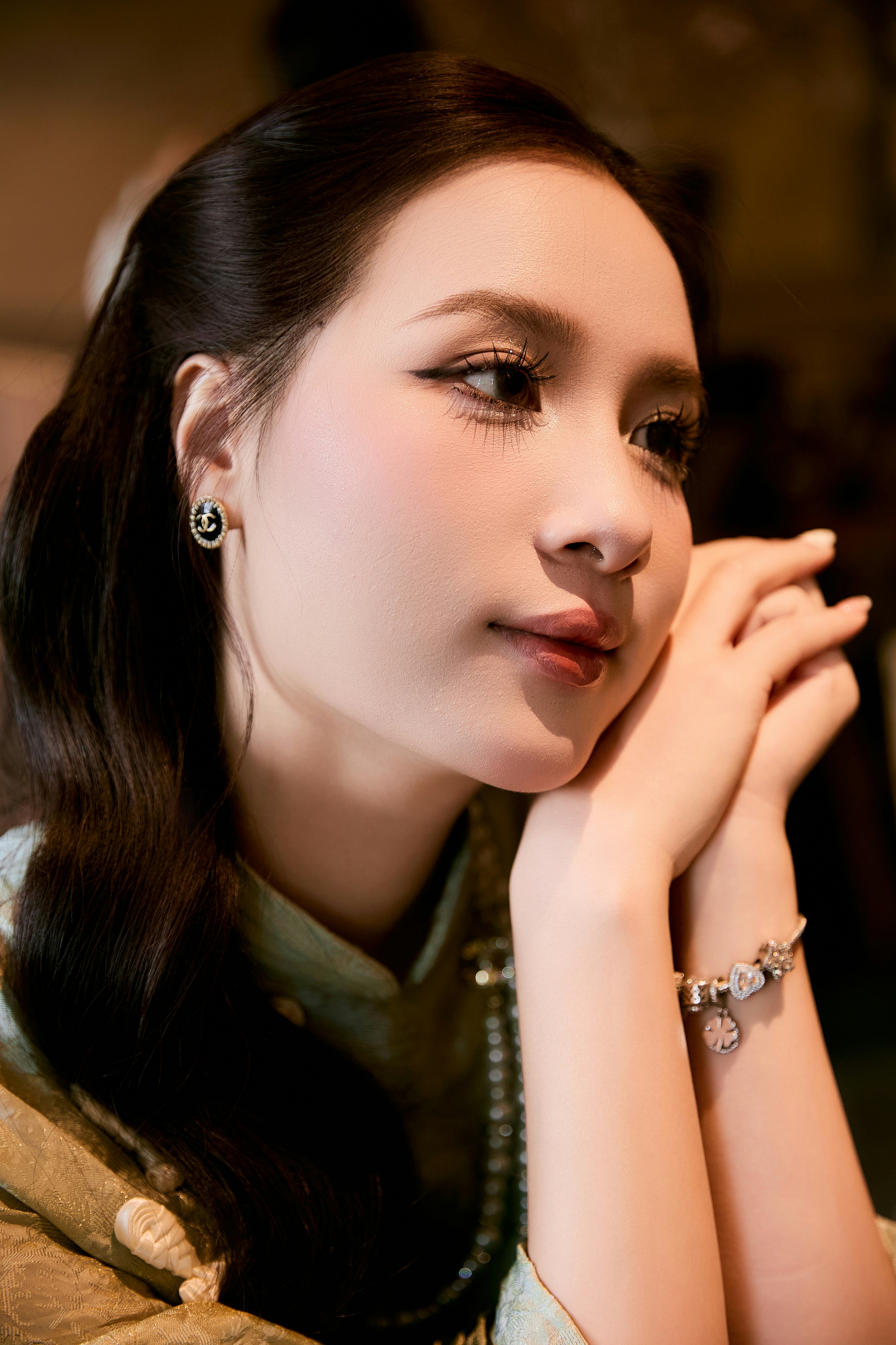 Soft Portrait of Contemplation: A Lady in Gentle Light