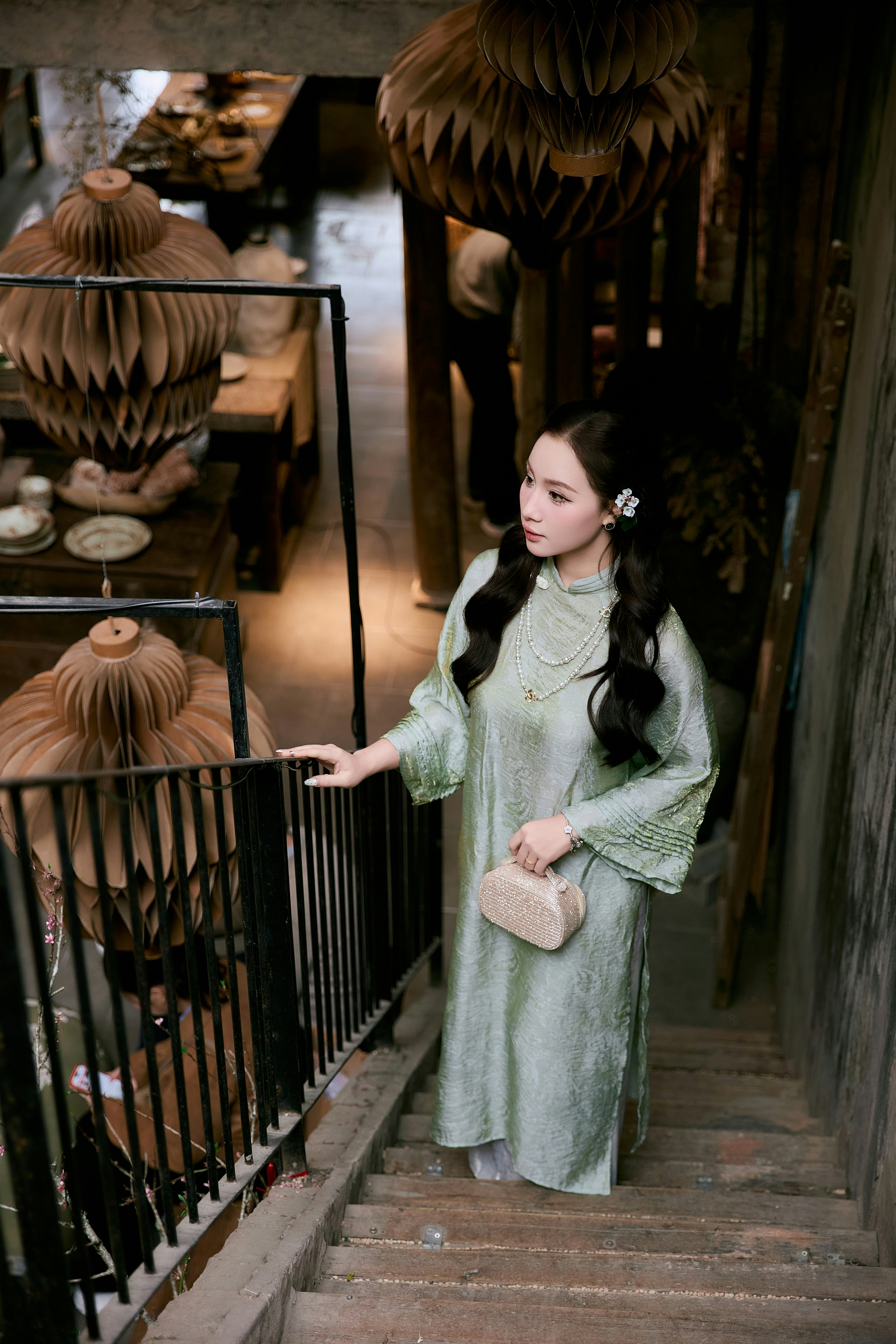 Silk-green Moment: A Portrait Above the Staircase