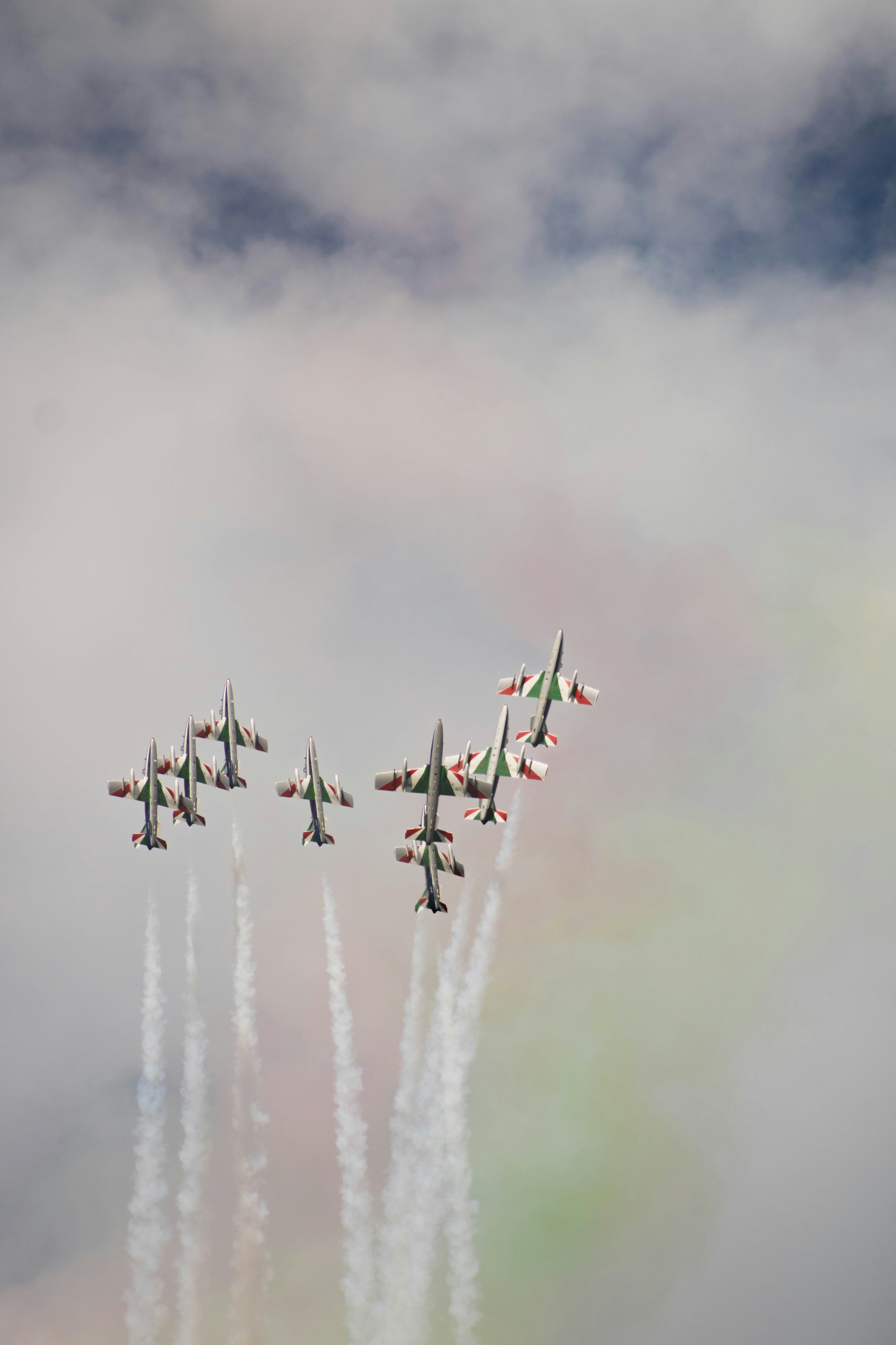 Vibrant V-Formation: Aerial Array Converges in Colorful Plume