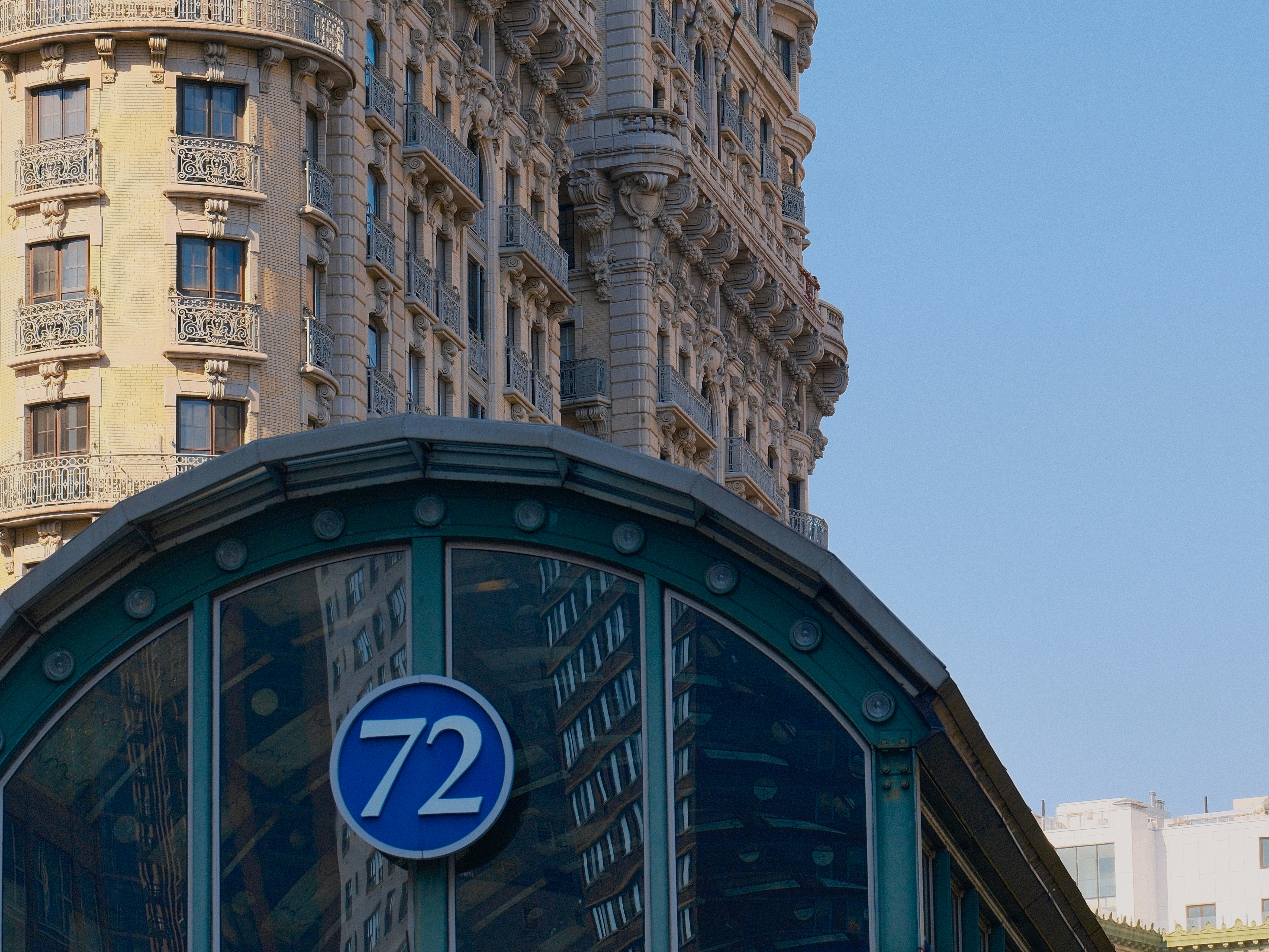 Urban Archways and a Street Sign: The 72 in Front of a Historic Facade