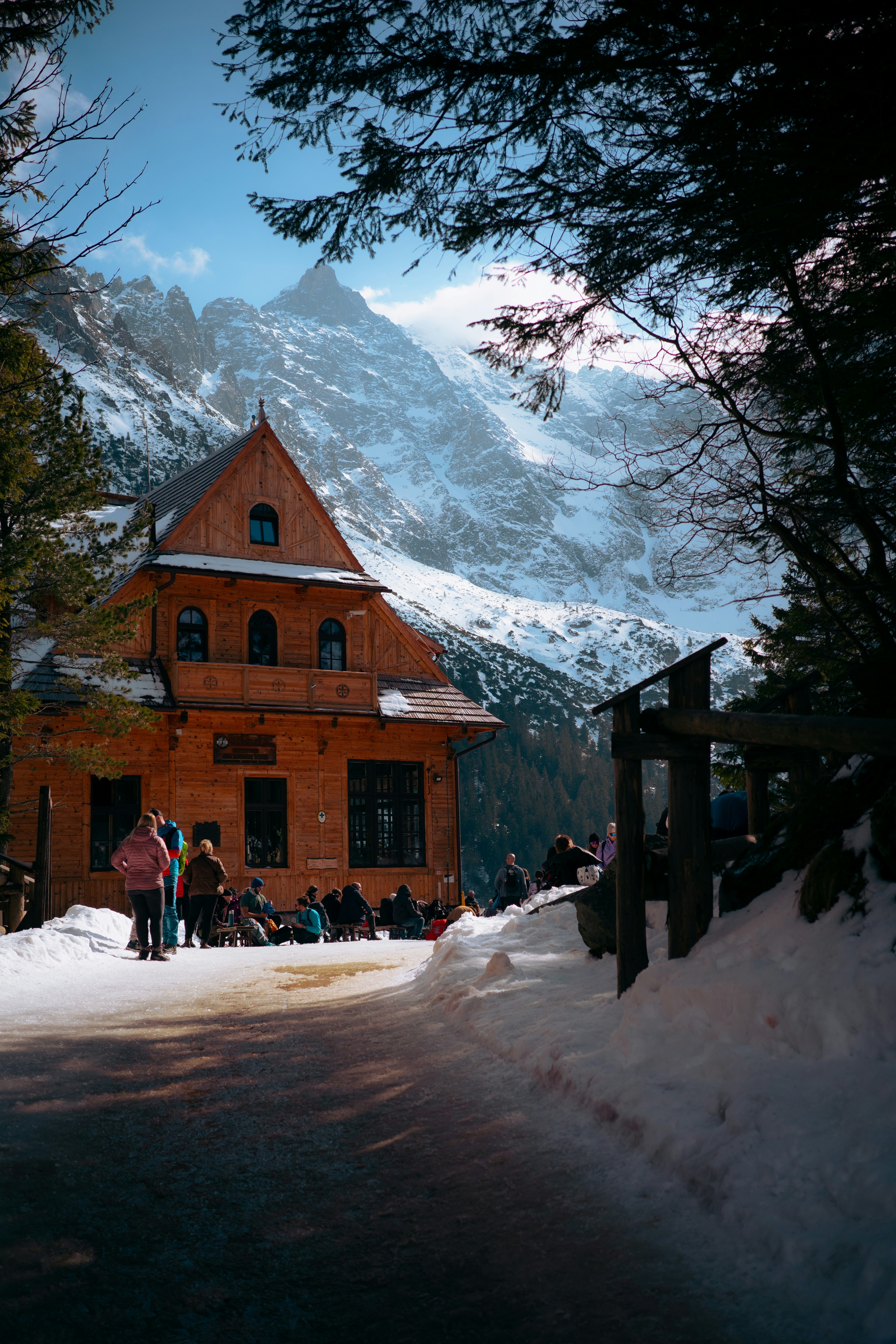 Snowy Chalet Courtyard Beneath Alpine Peaks