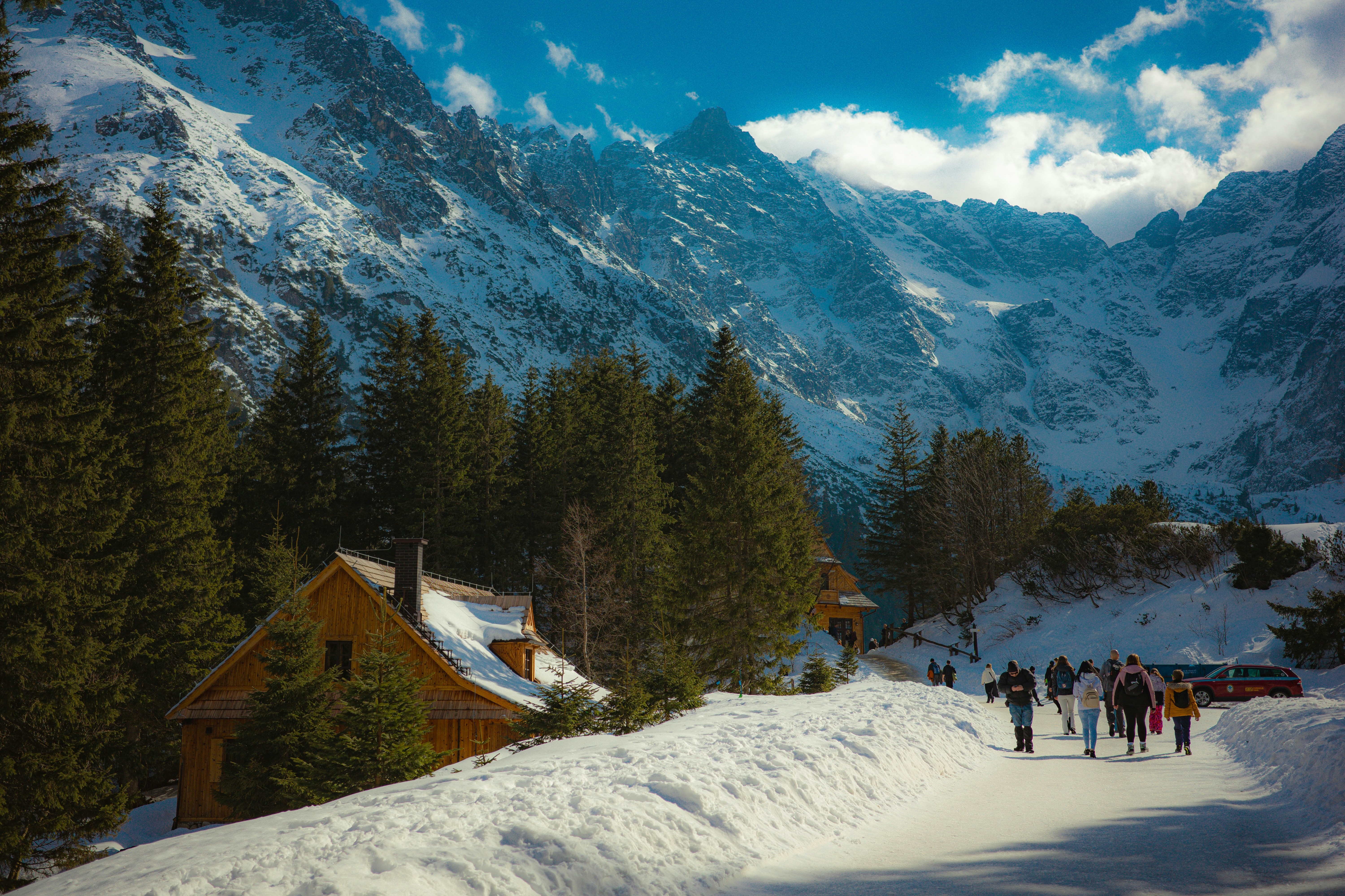 Snowbound Village Trail Beneath Alpine Peaks