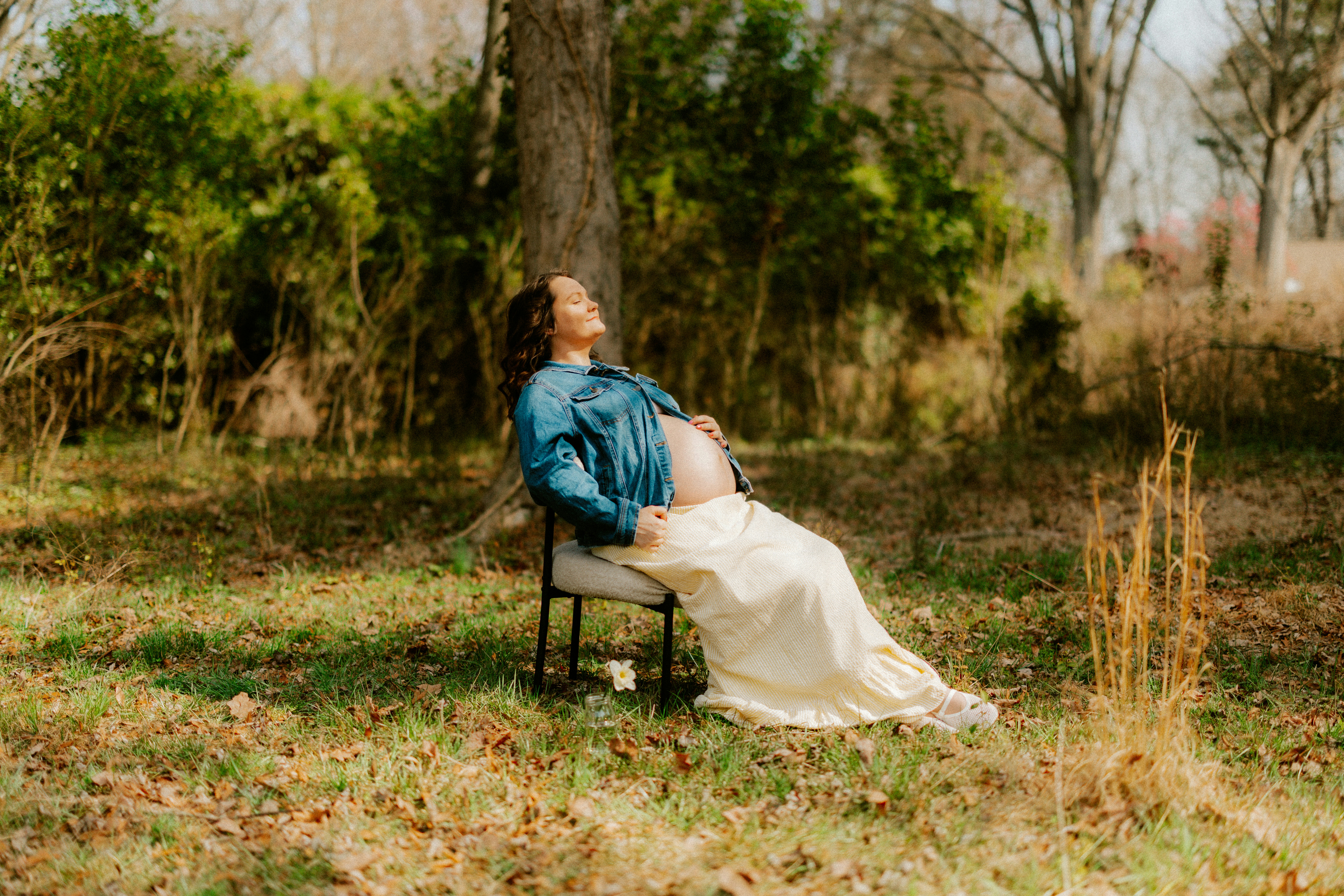 Pregnant woman relaxing in a chair outdoors