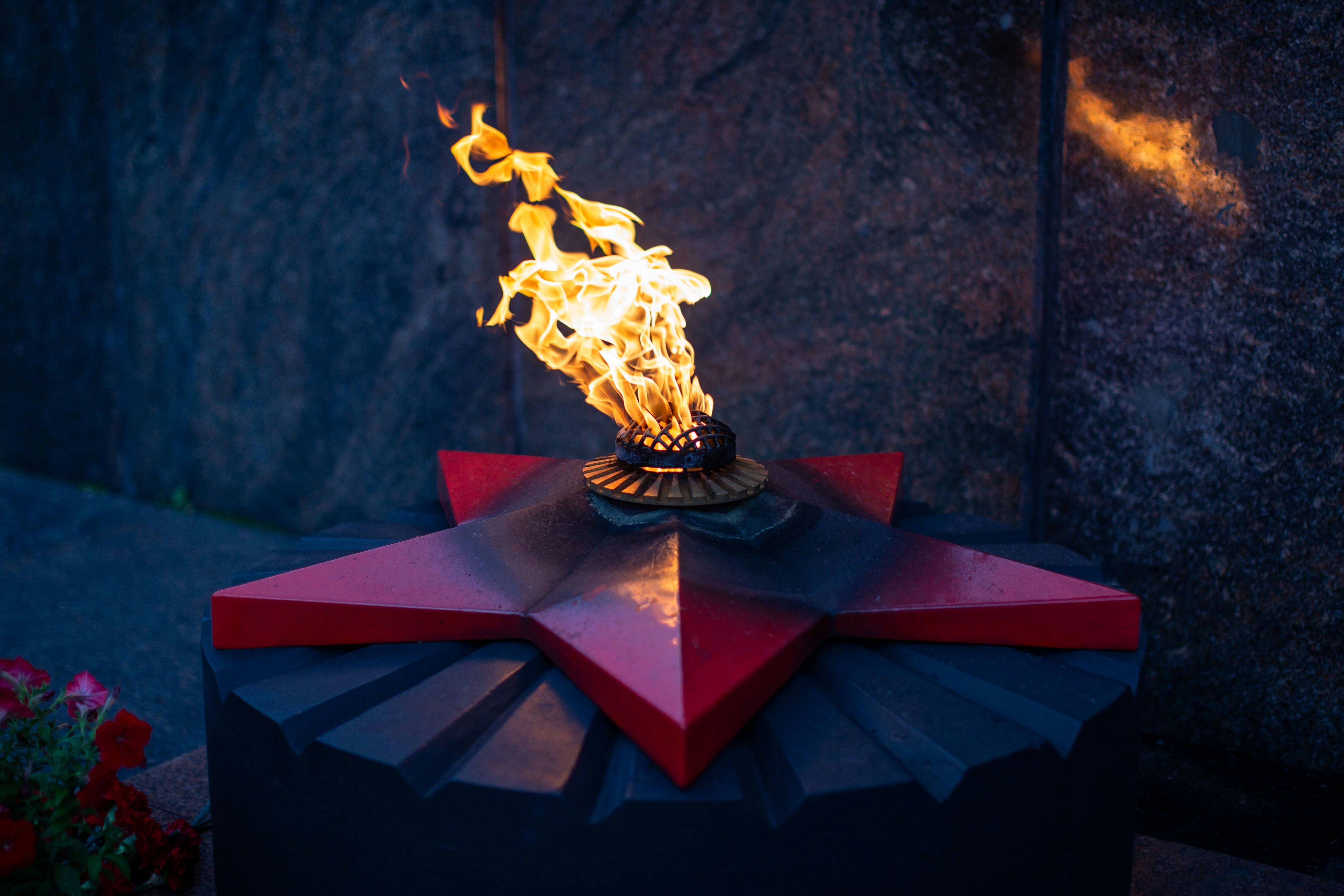 Flame on a Faceted Star: An Ember at the Center of the Monument
