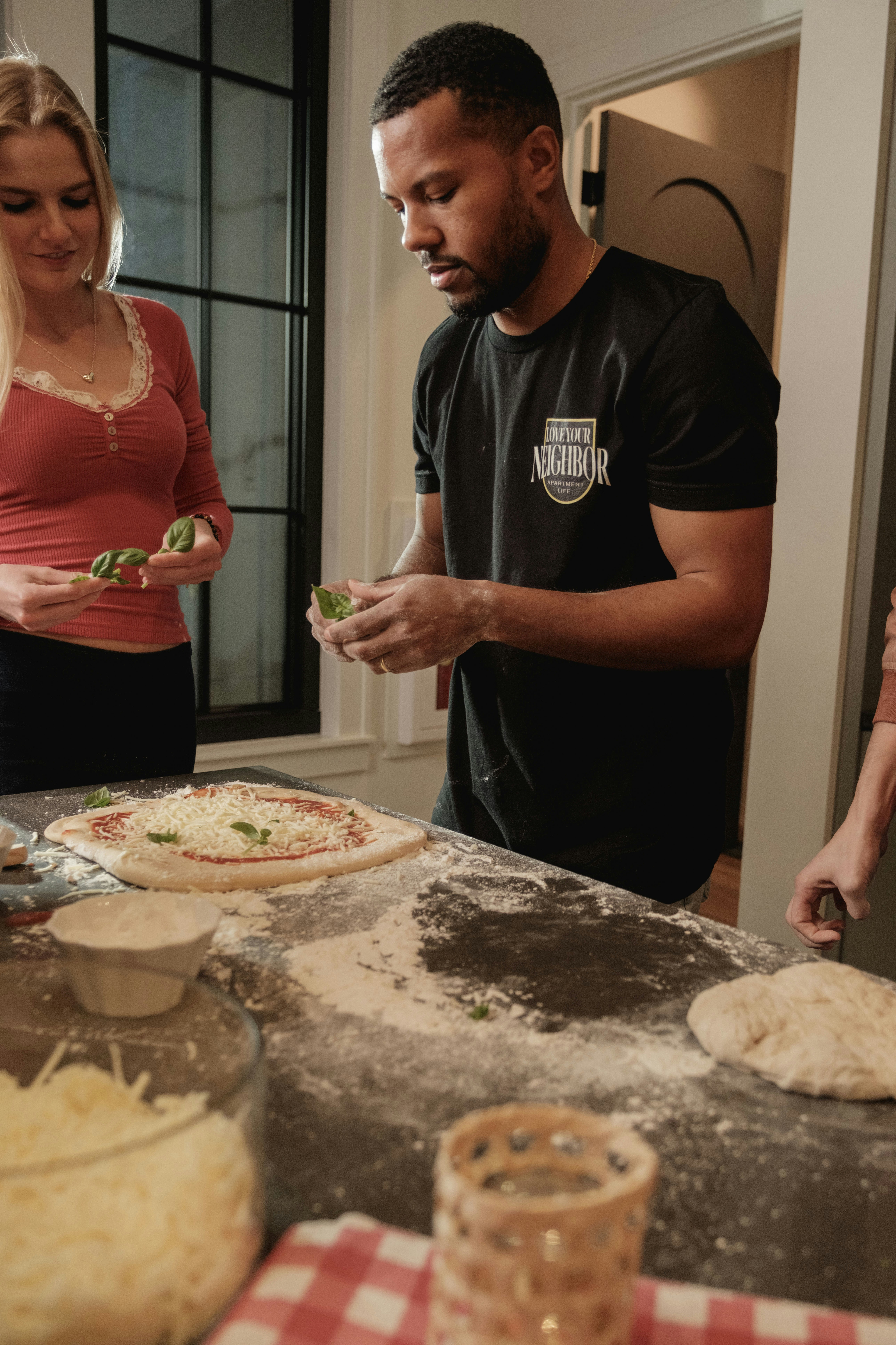 Hands on dough, a moment of focus in a cozy kitchen