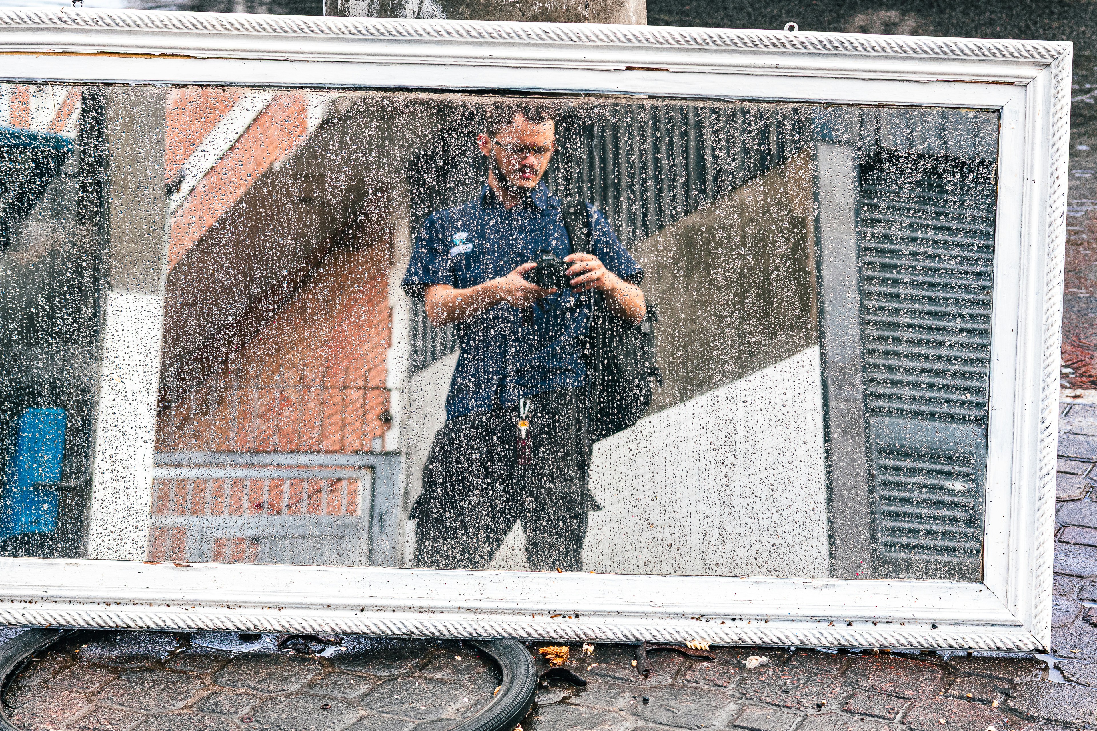 Reflection in a Glass Frame: A Photographer Captures the Moment