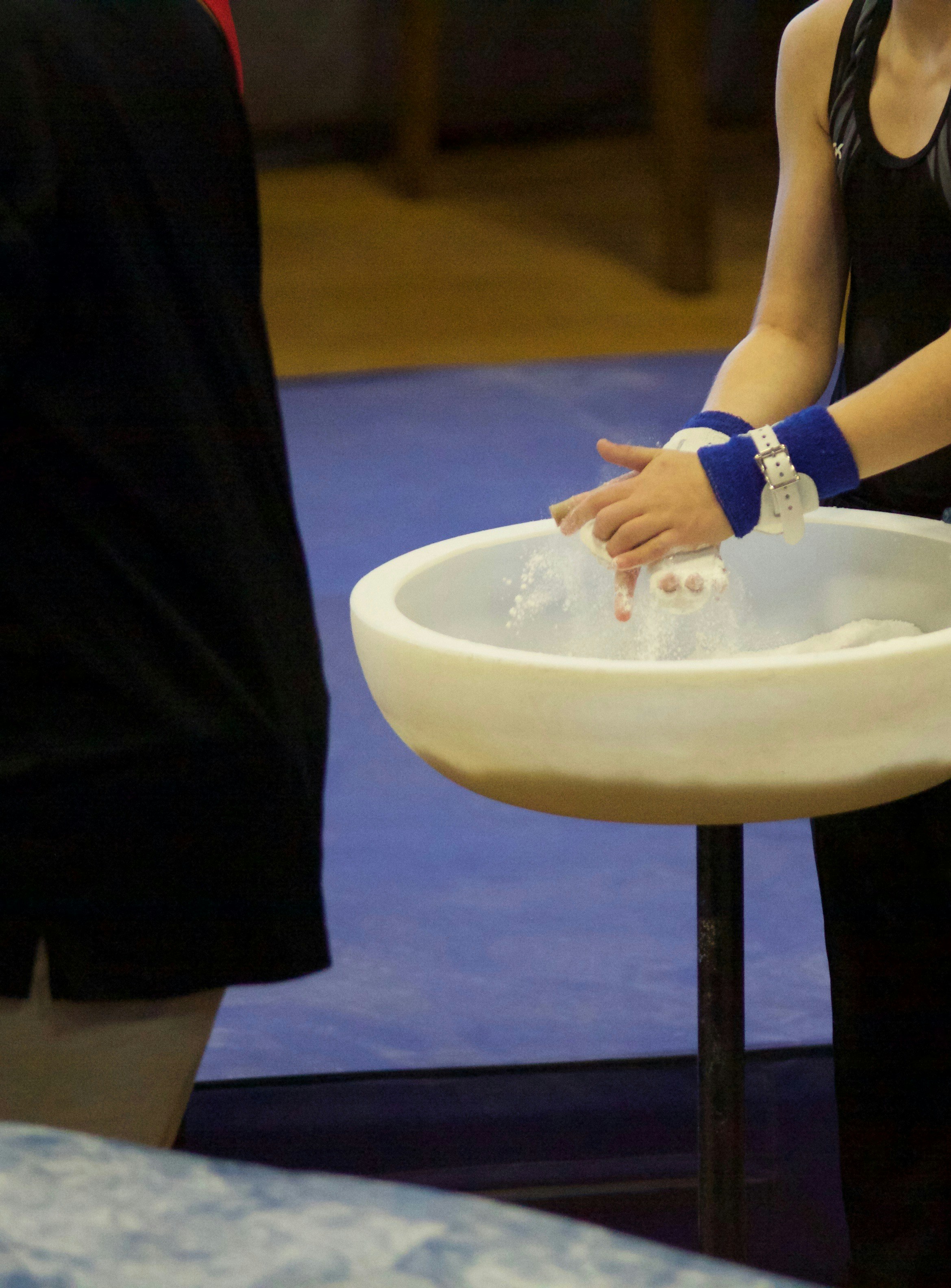 Hands in the Basin: A Gymnastic Pause at the Sink