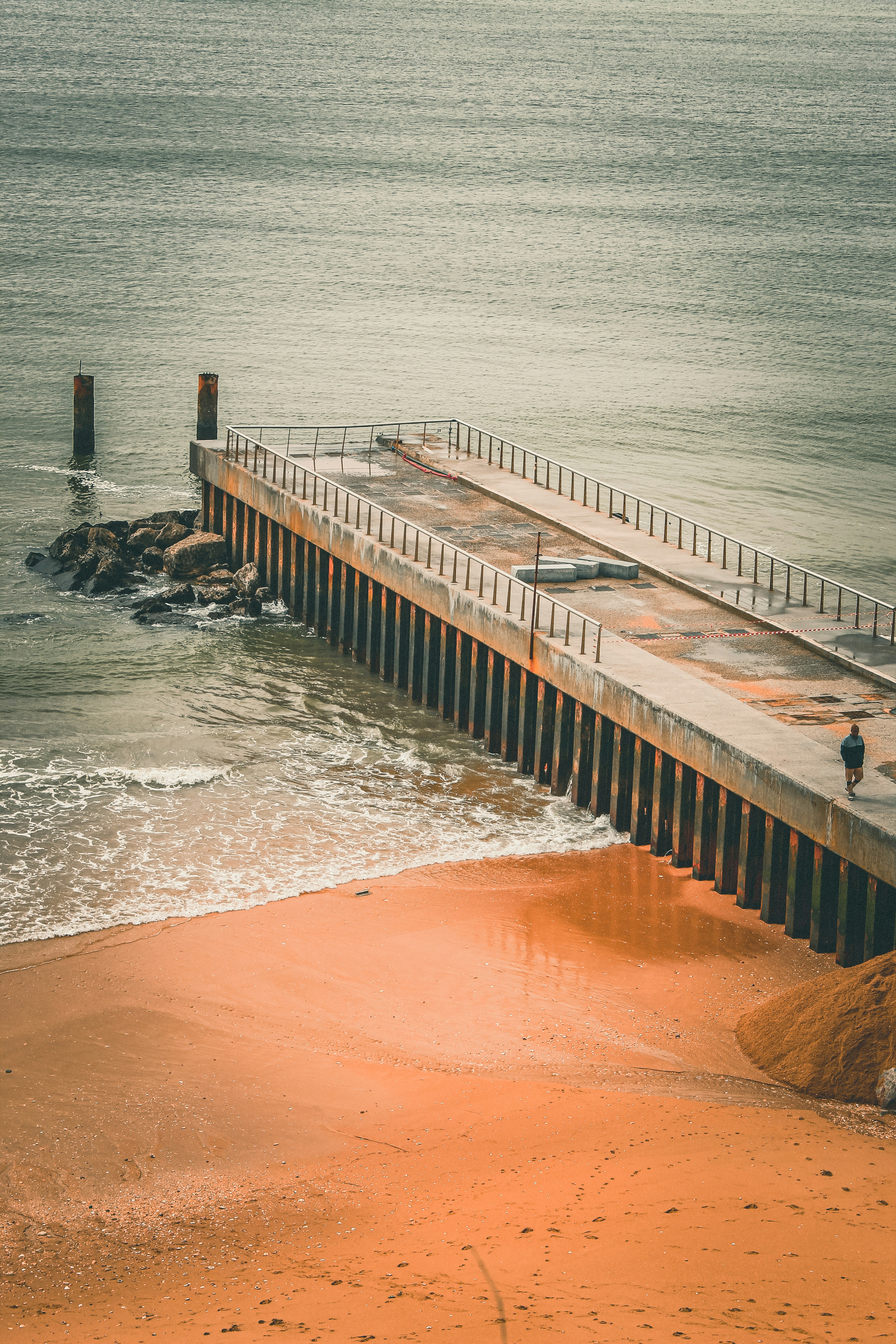 End of the Pier: A Quiet Walk Over Rust and Sea