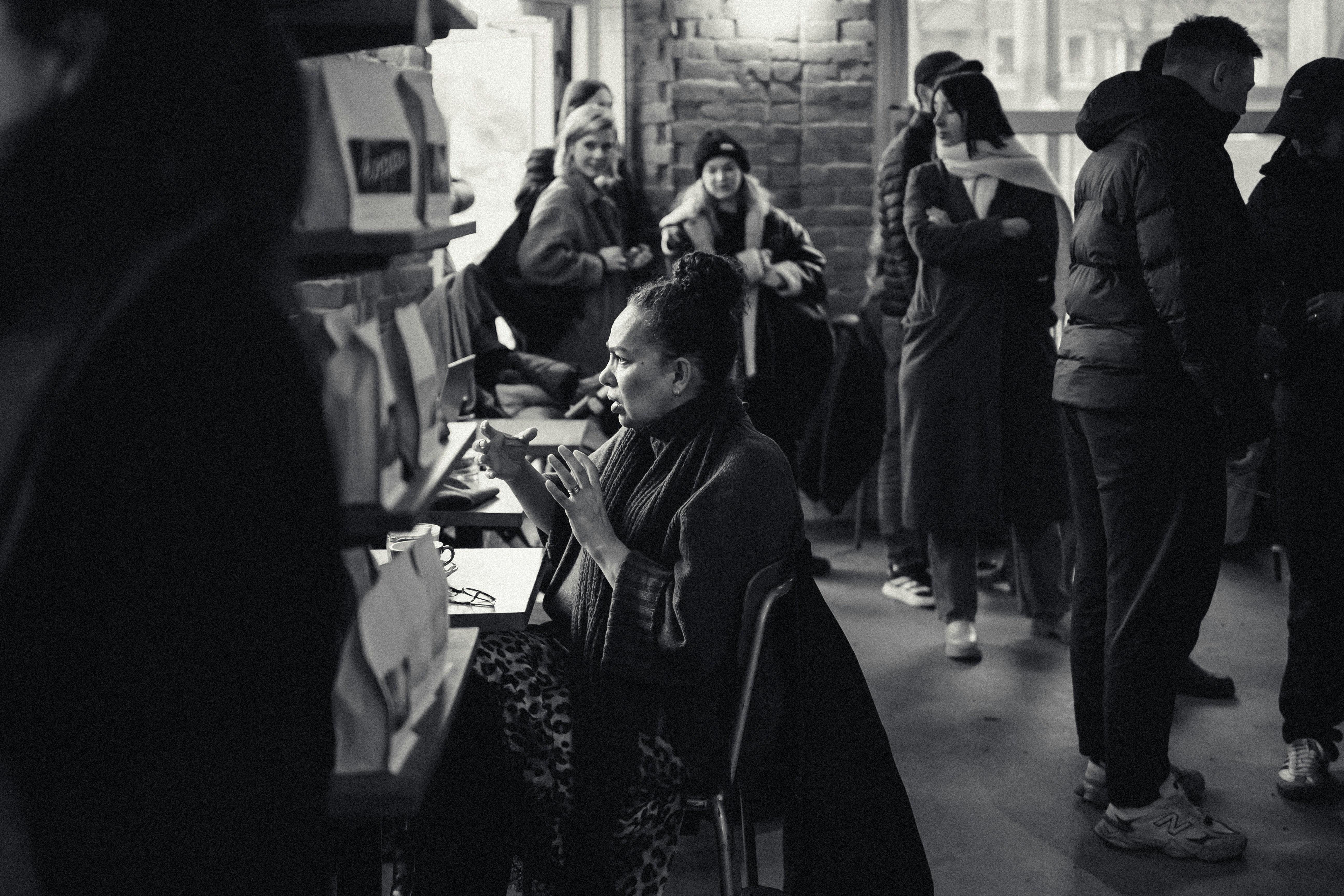 Beside the Bar: A Quiet Moment Amid the Street Ensemble