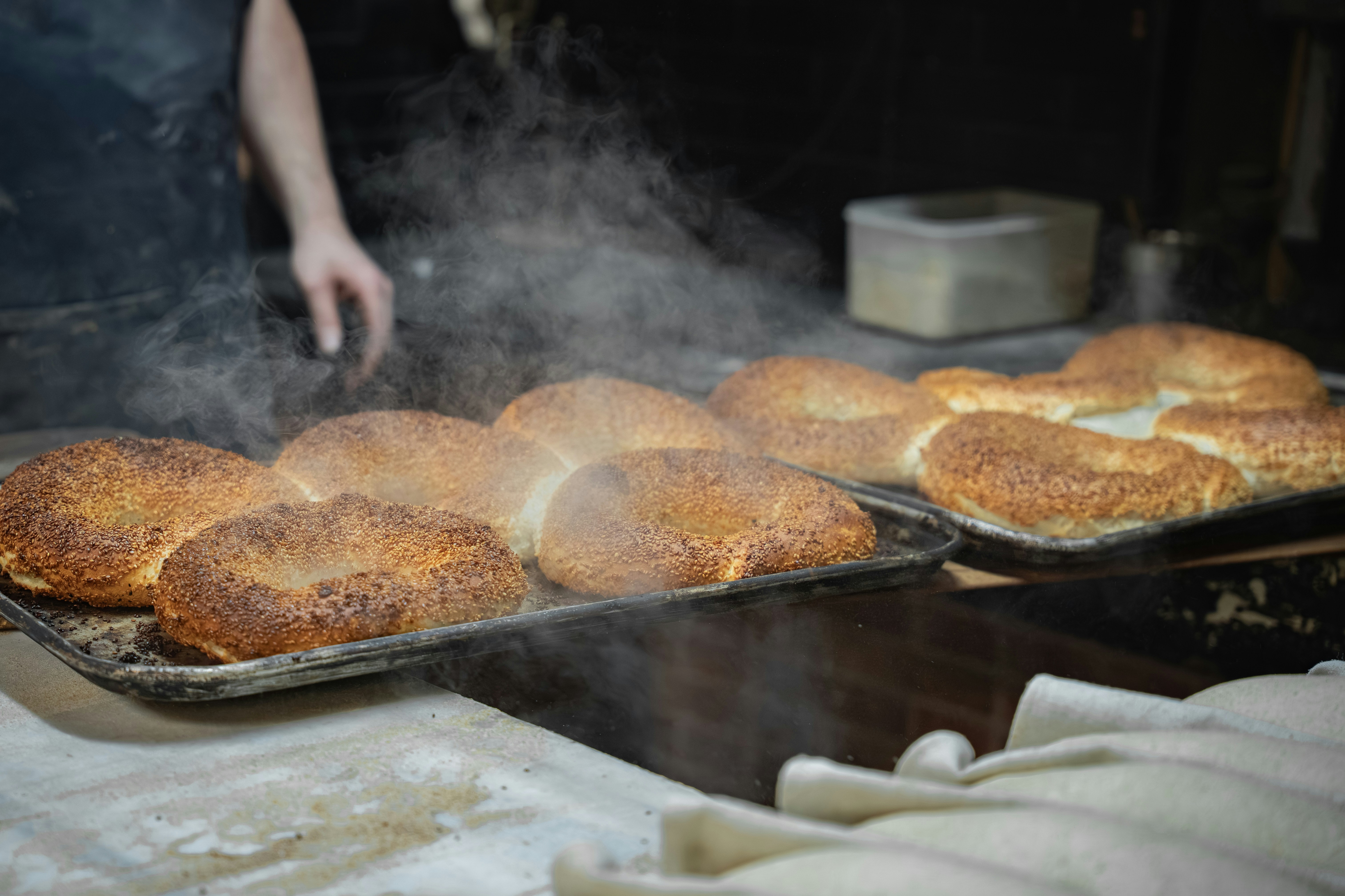Steam-Kissed Buns on the Tray: A Busy Bakery Moment