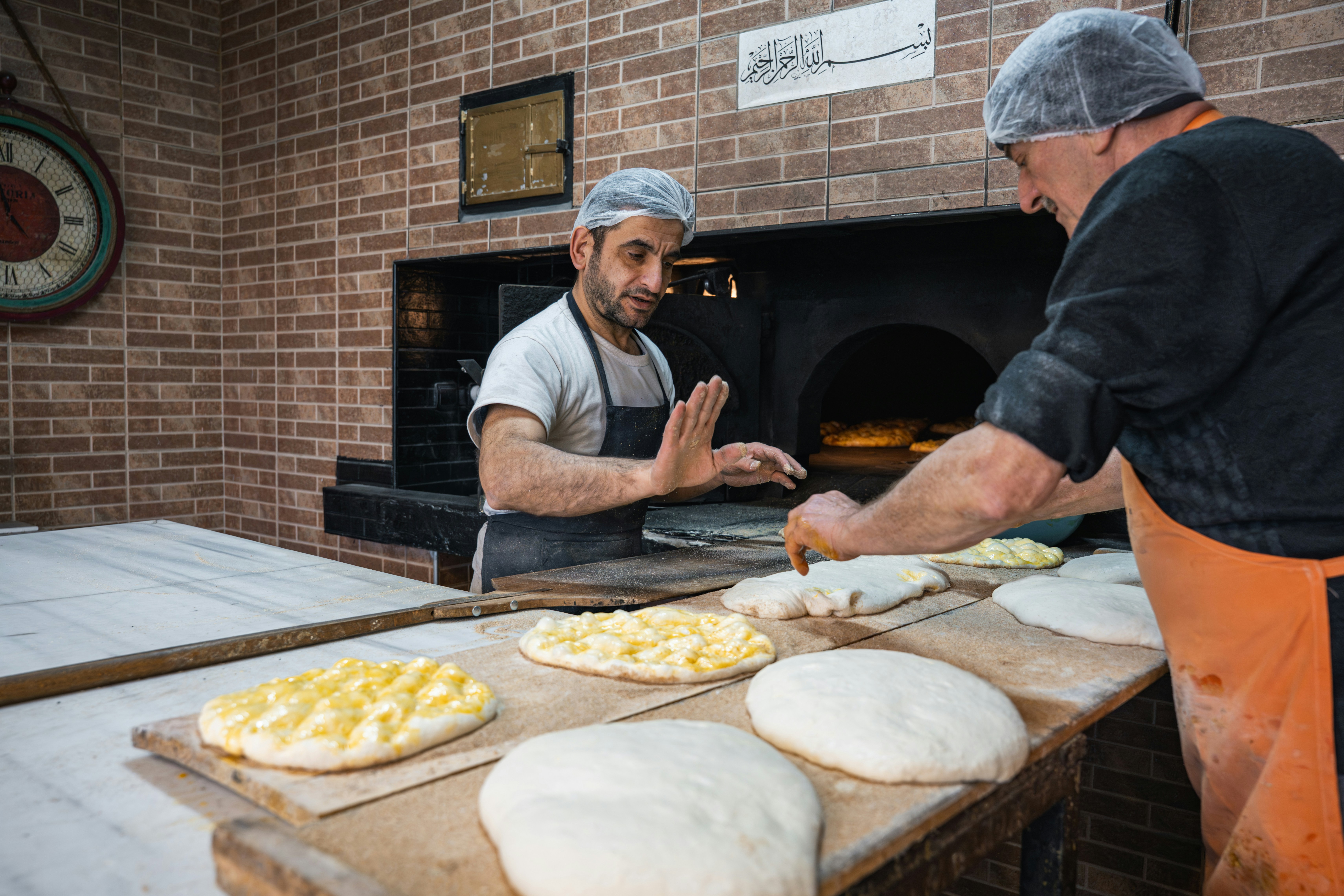 Wood-fired Bakery Dance: Hands, Dough, and Fire